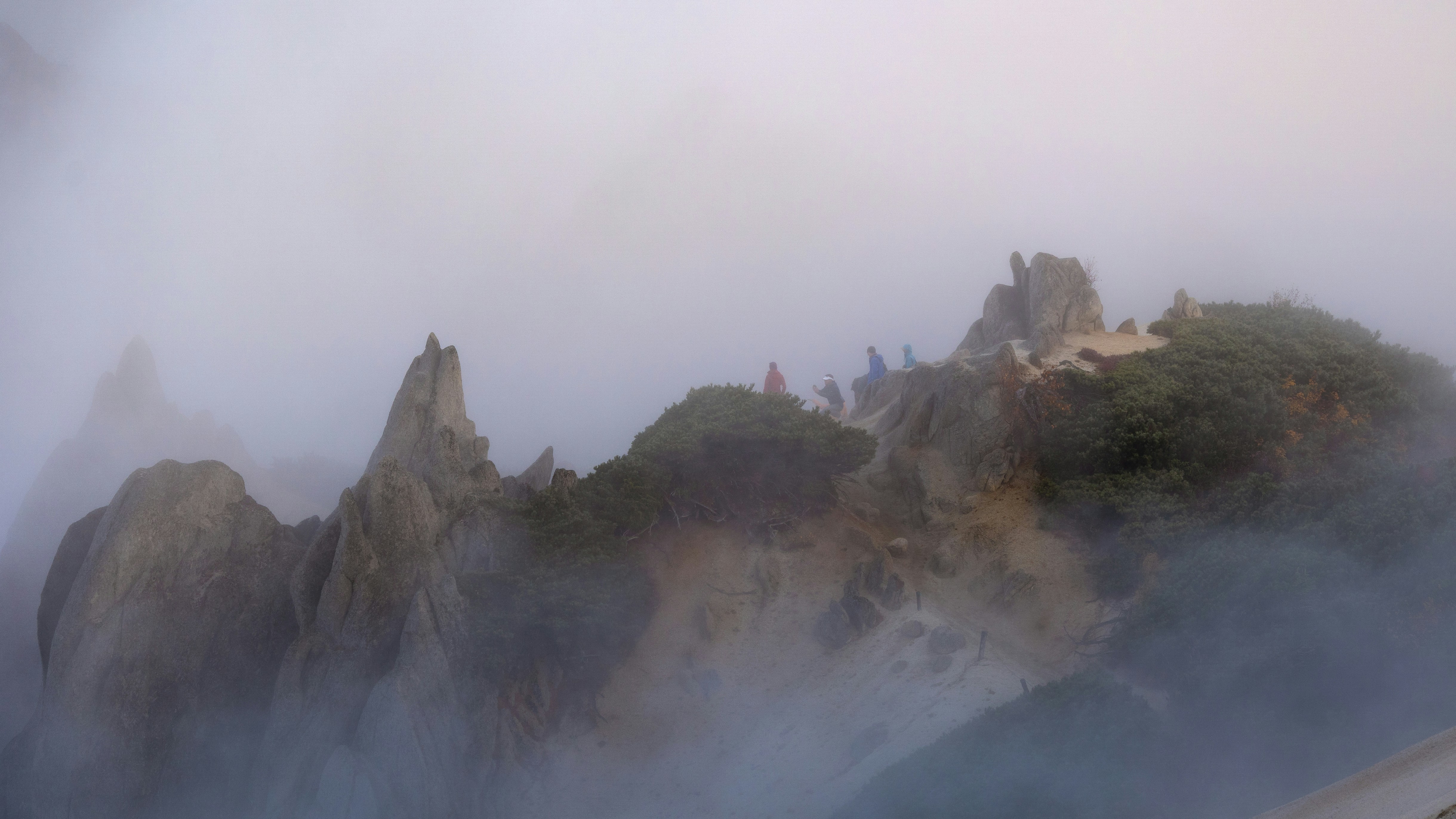 Mist-kissed Ridge: silhouettes among jagged cliffs