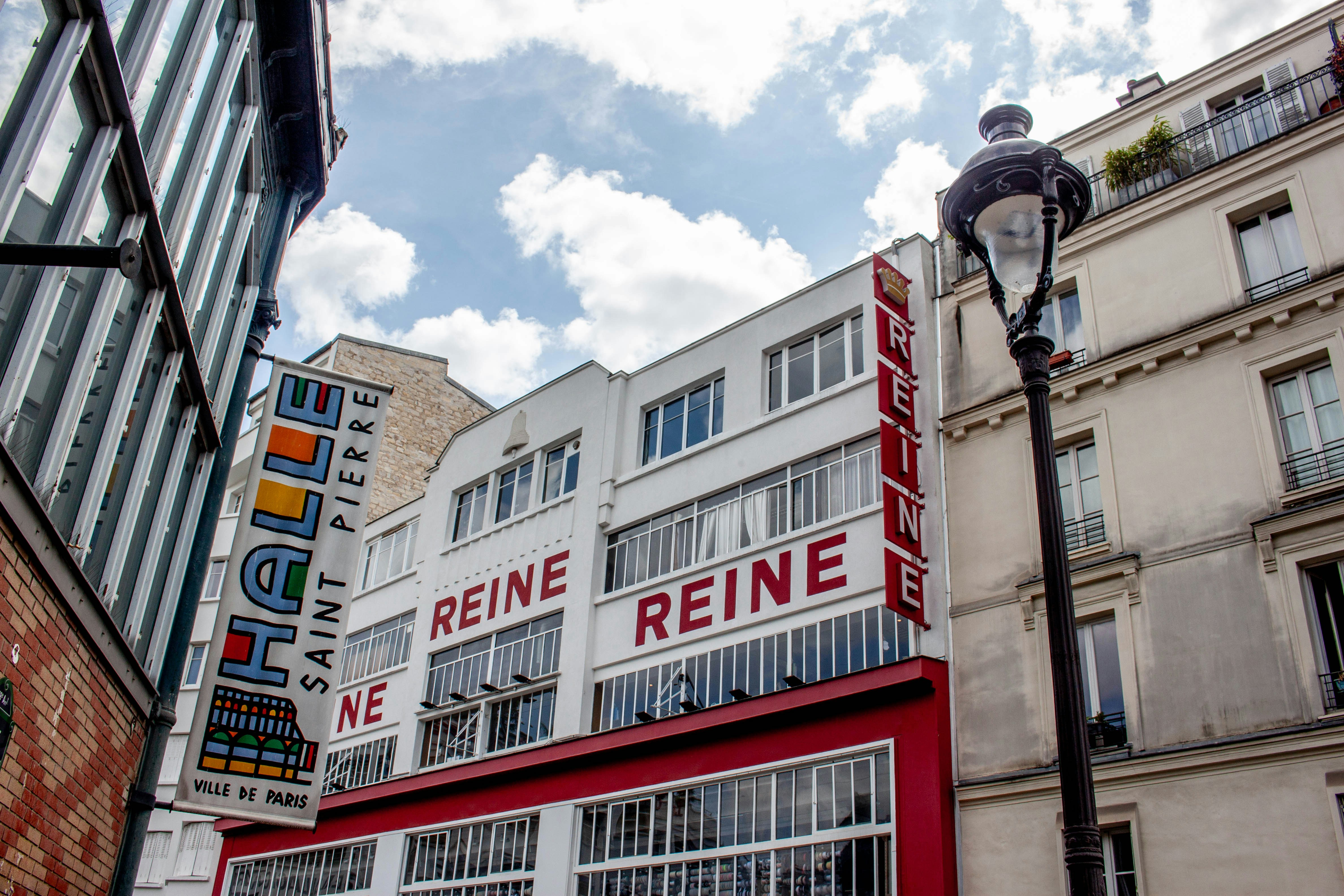 Parisian theatre facade under a bright sky