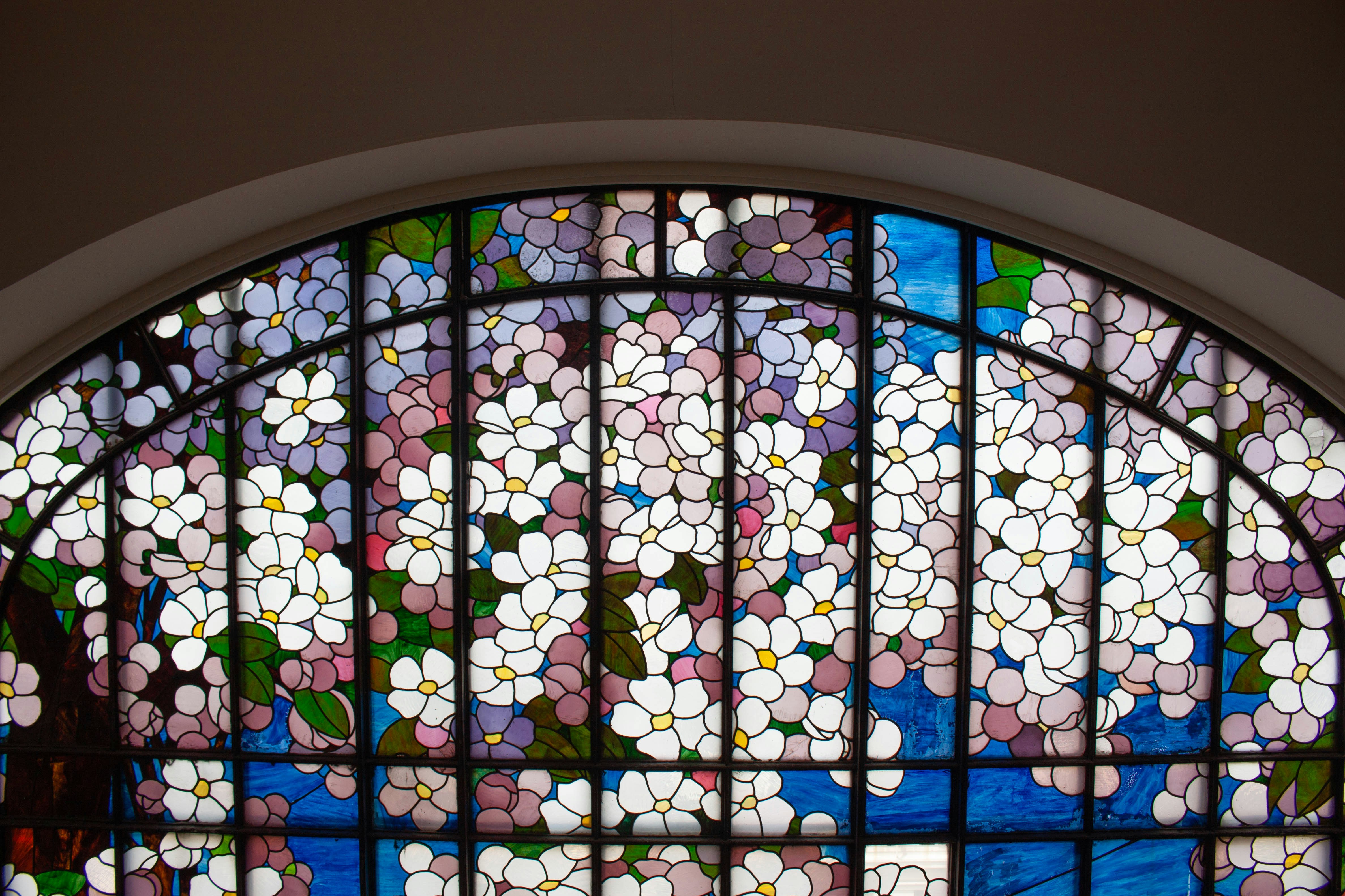 Stained-Glass Bloom: A Circular Window of Flowered Light
