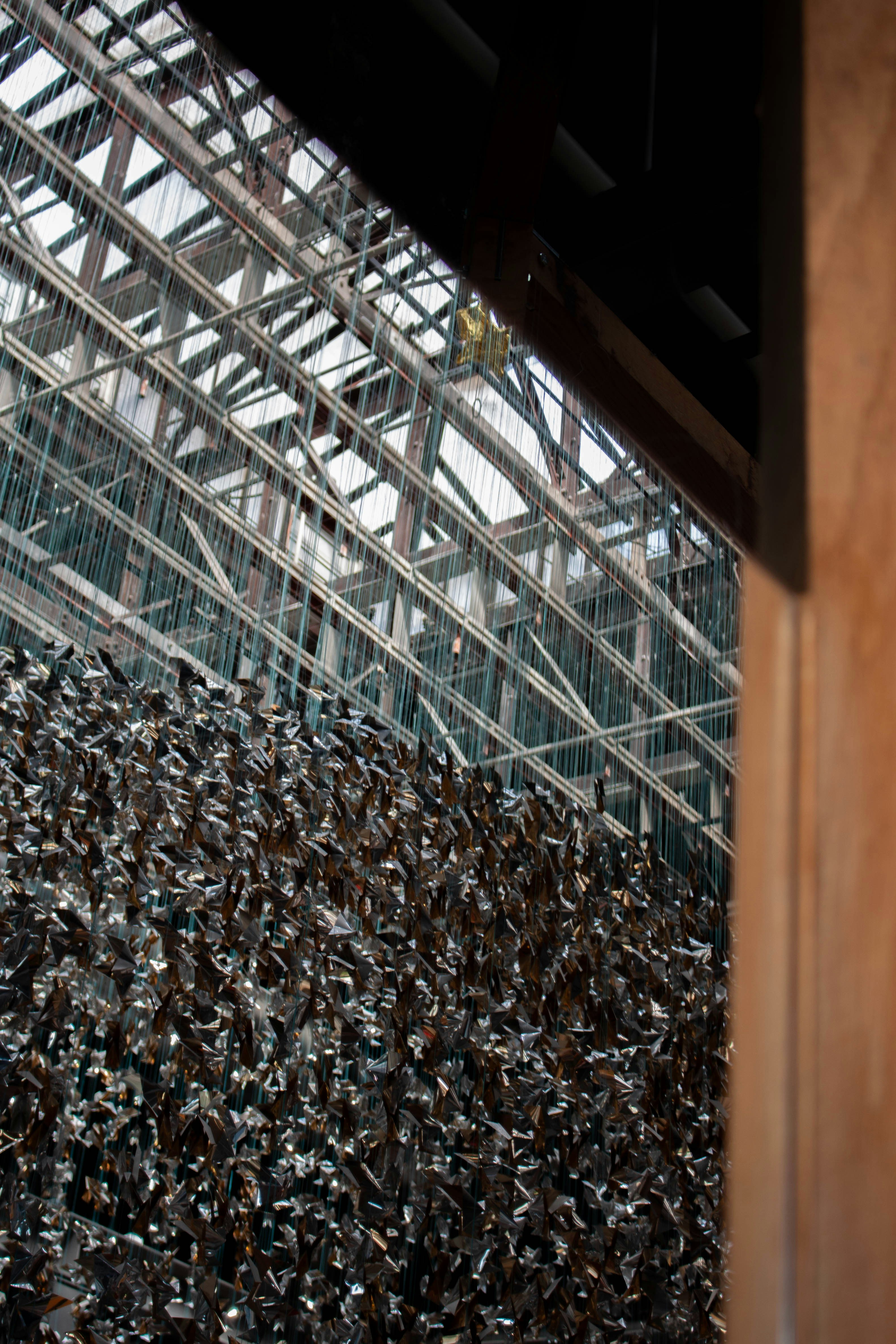 Crisscrossed Glass and Steel: A Corner View into a Textured Atrium
