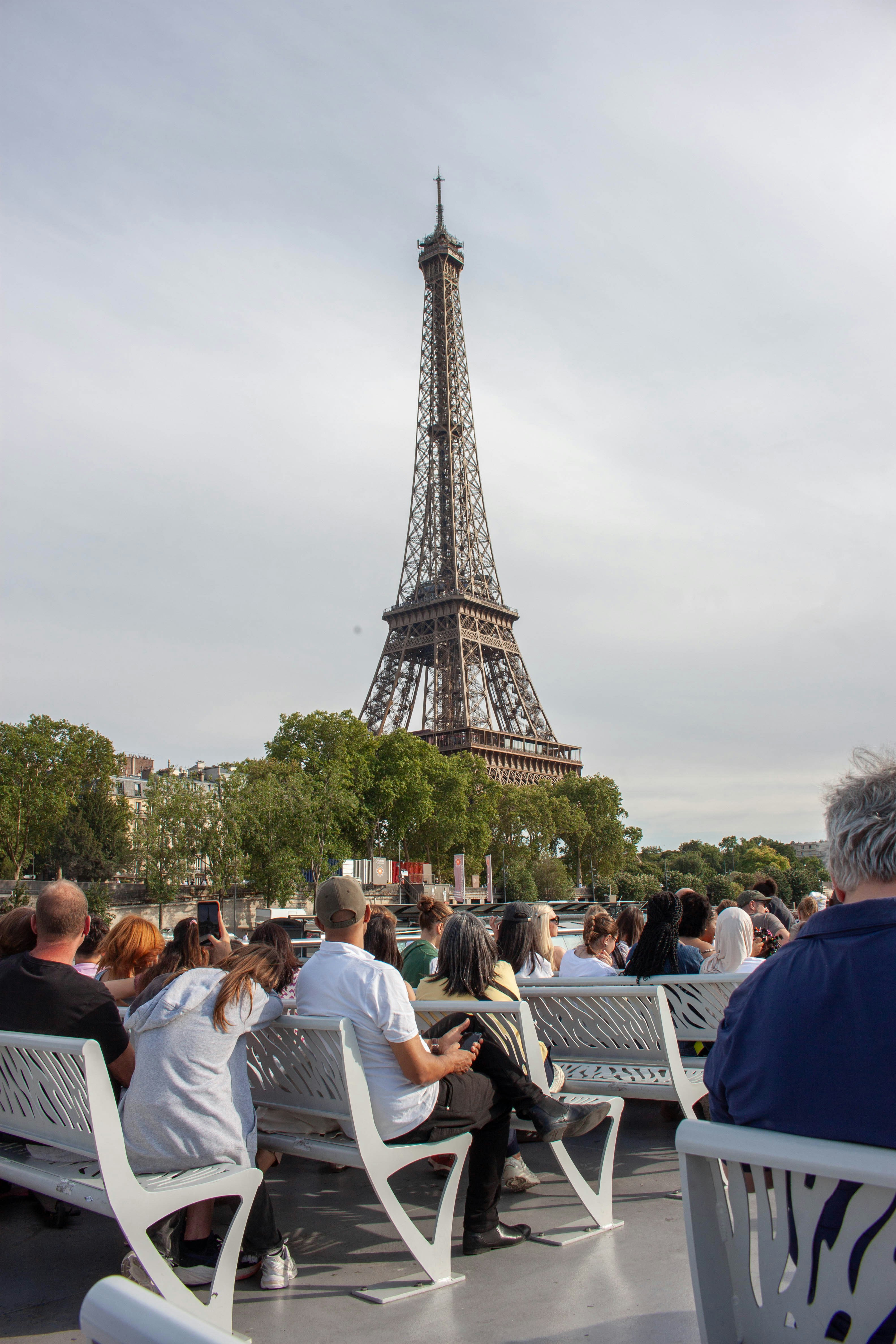 Eiffel Vista: Evening Crowd Gathers Under the Tower