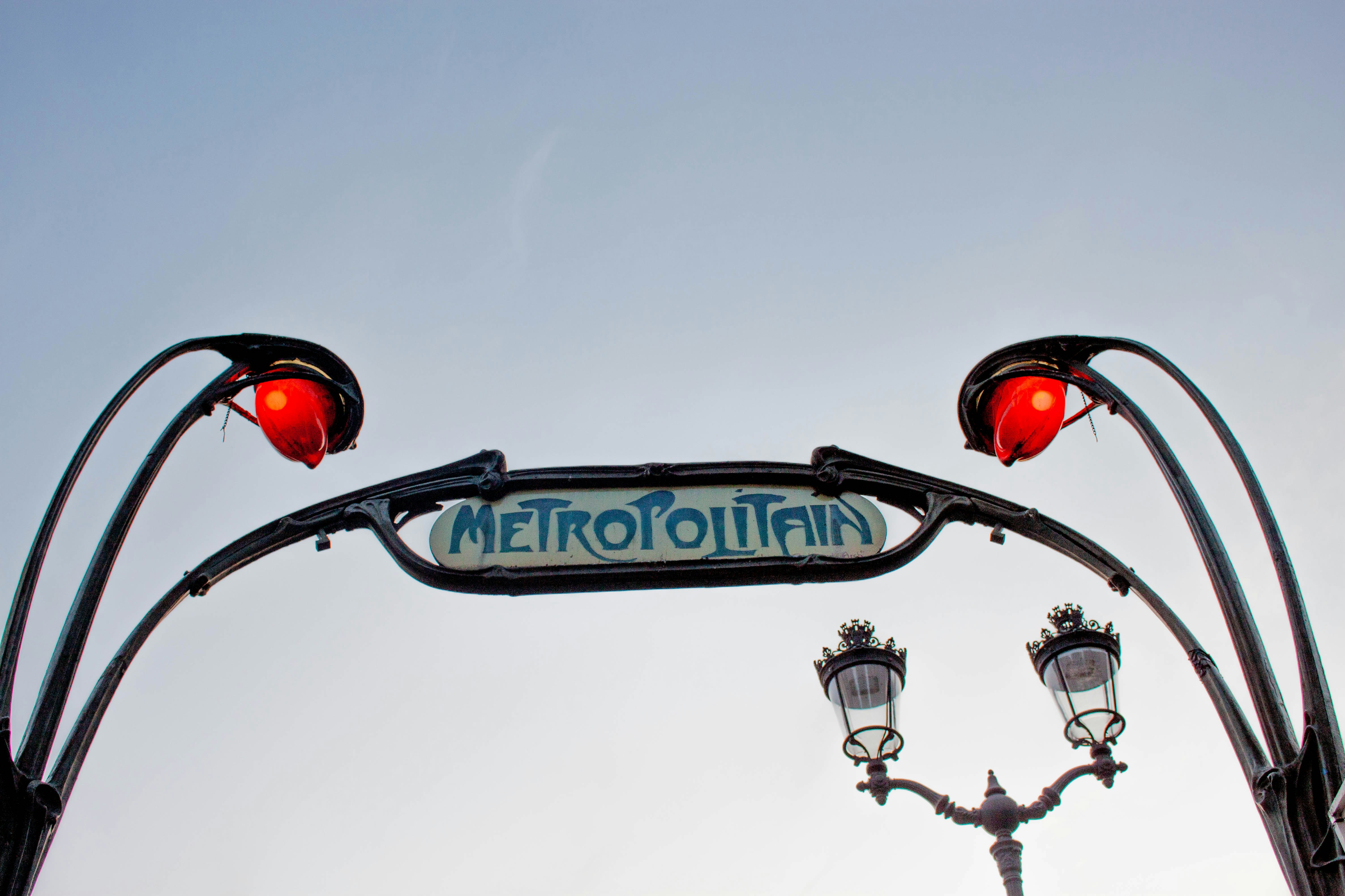 Metro Gate: Art Deco Sign Framed by Curved Lamp Arches