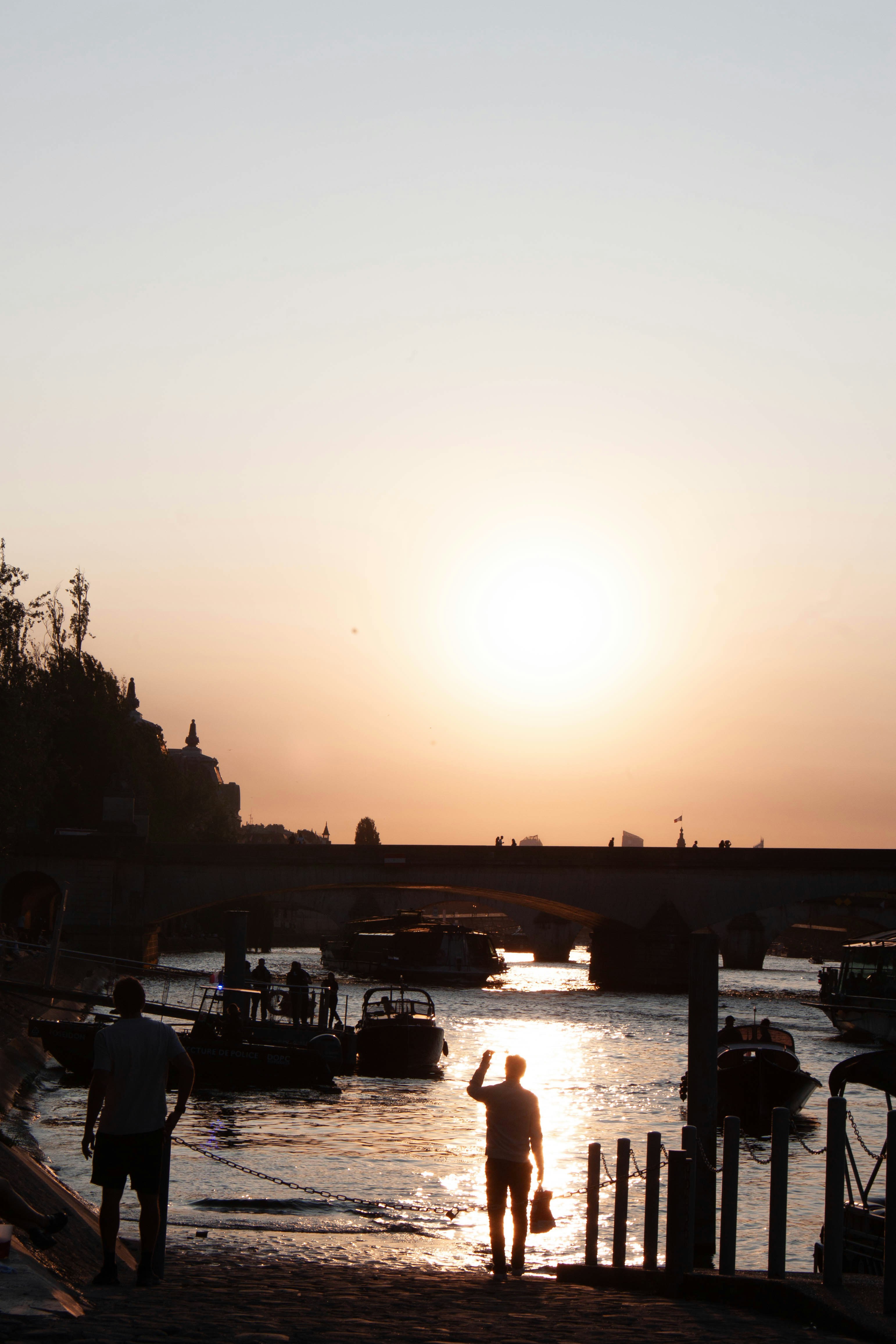 Silhouettes at Sundown Over the Riverside