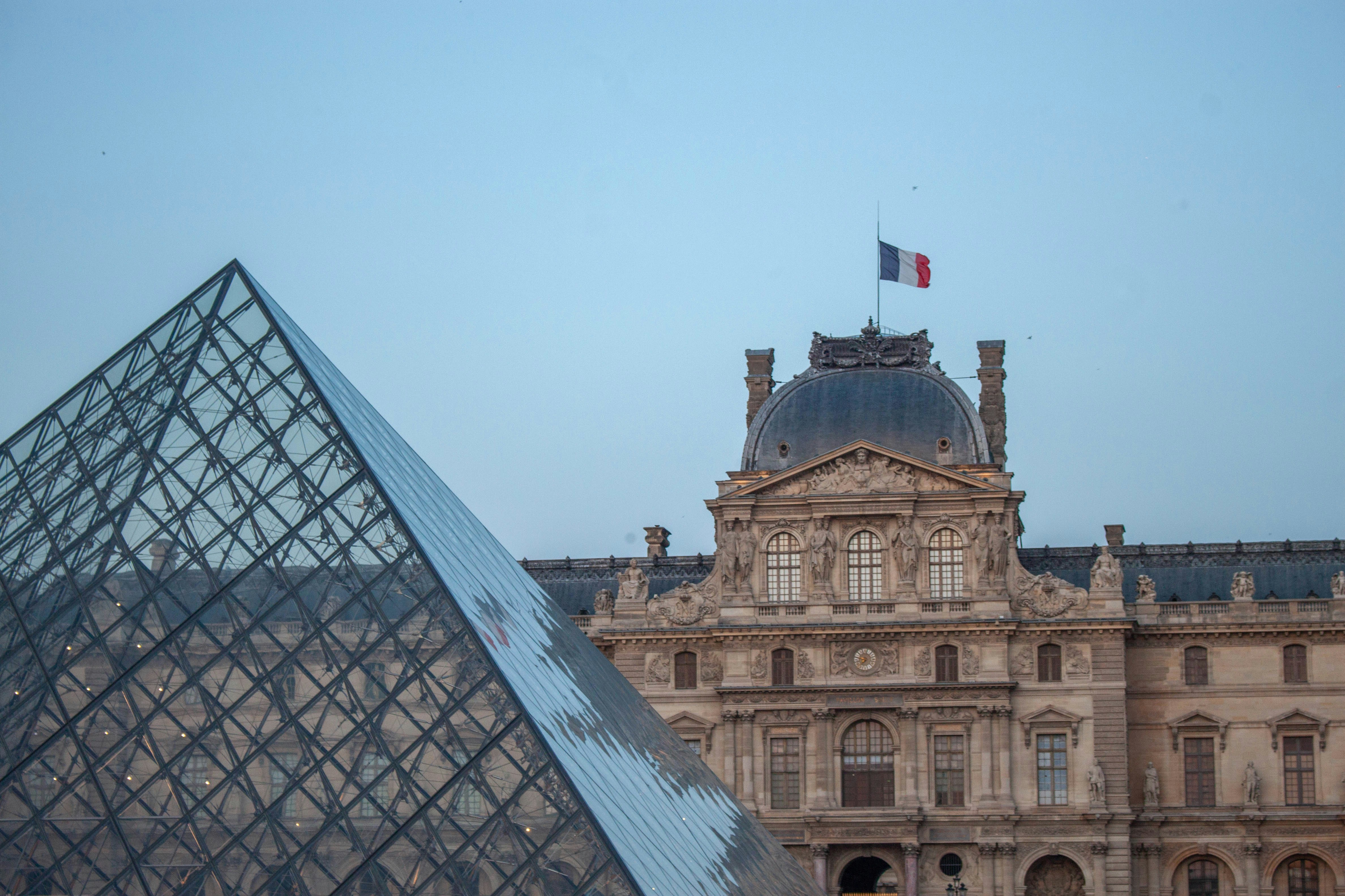 Pyramid and Classic Facade: Parisian Museum Geometry at Daybreak