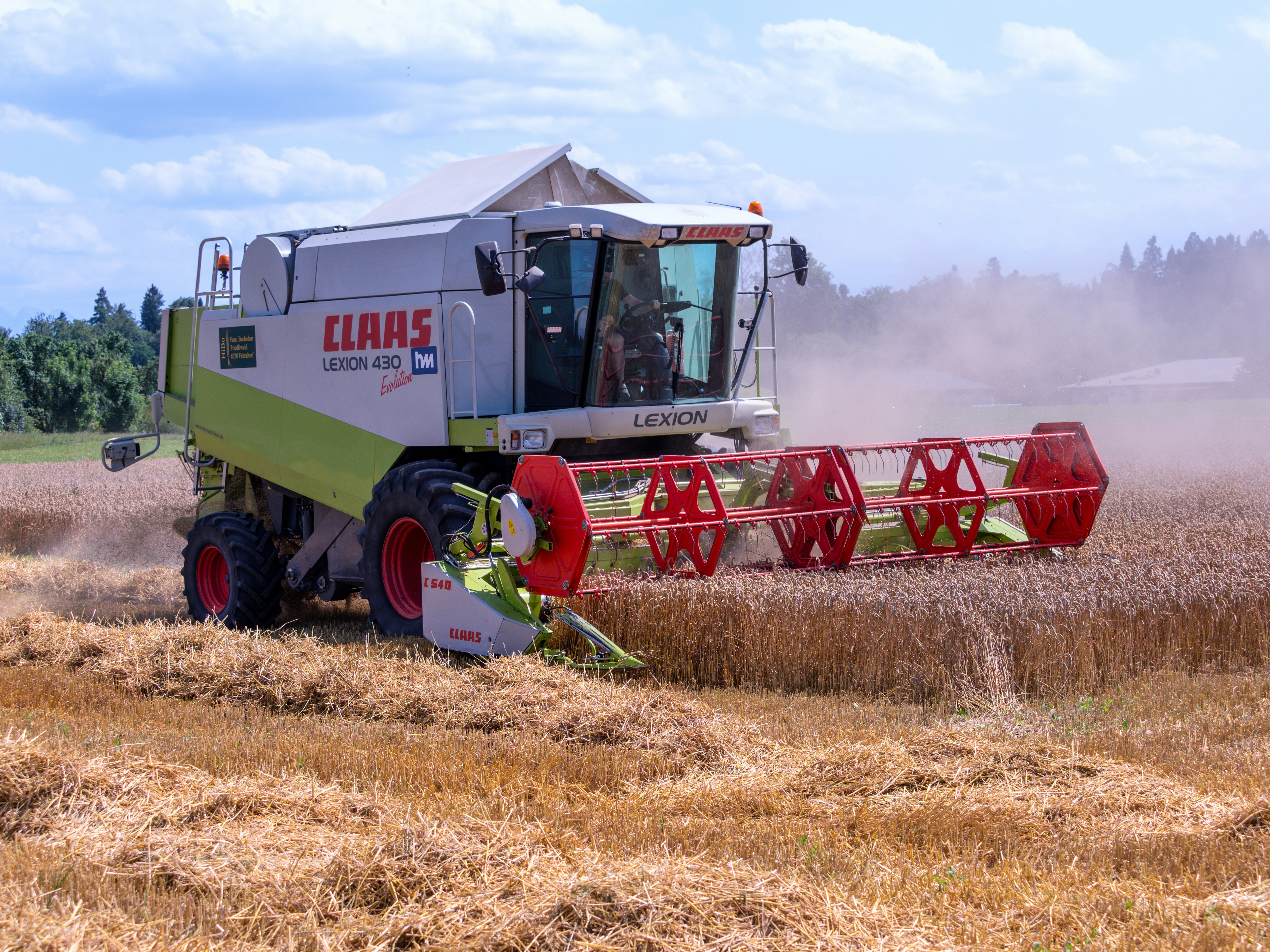 Harvest Horizon: CLAAS Lexion 430 Panoramic in Golden Field