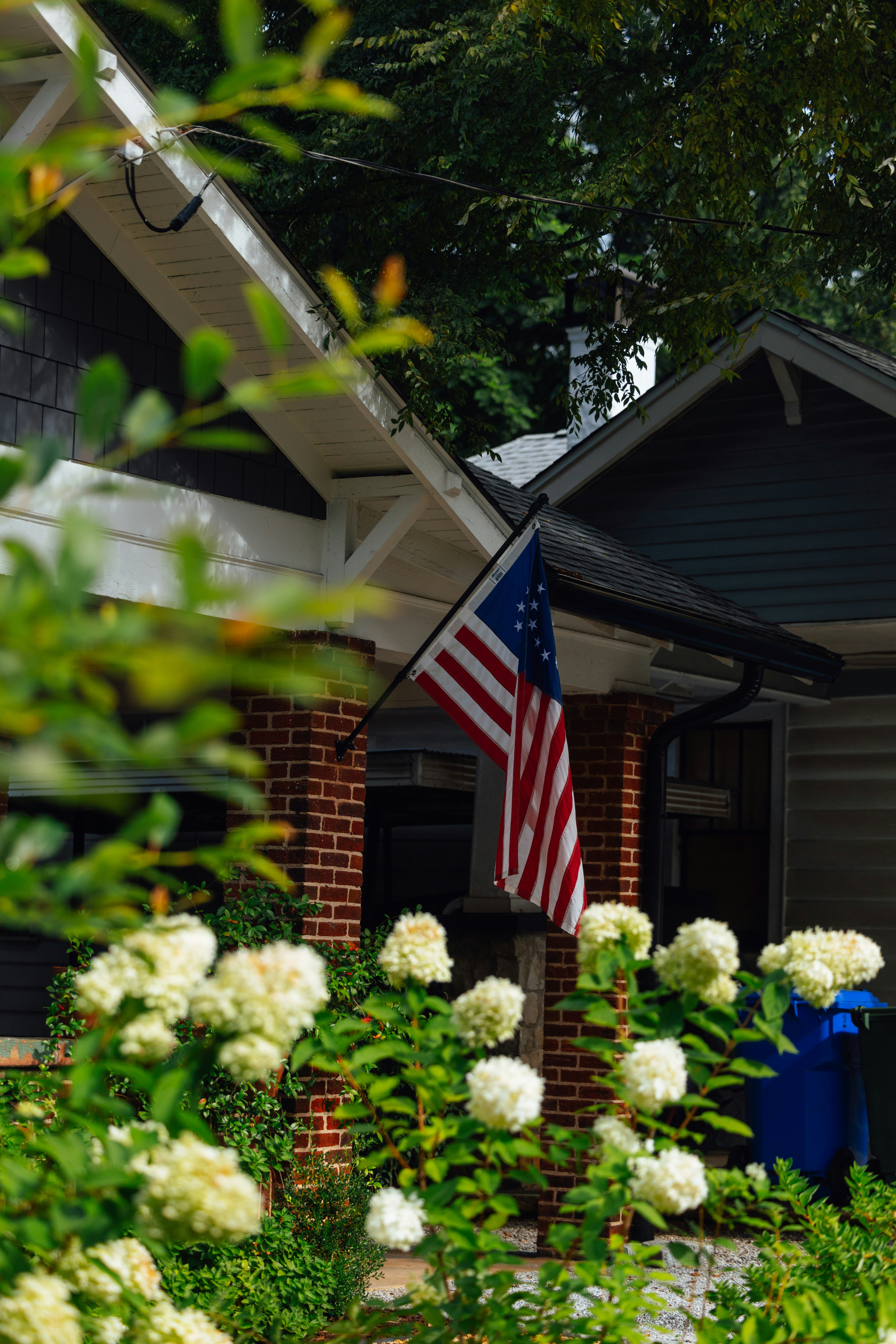 Flag at the Porch: Quiet Americana Framed by Hydrangeas