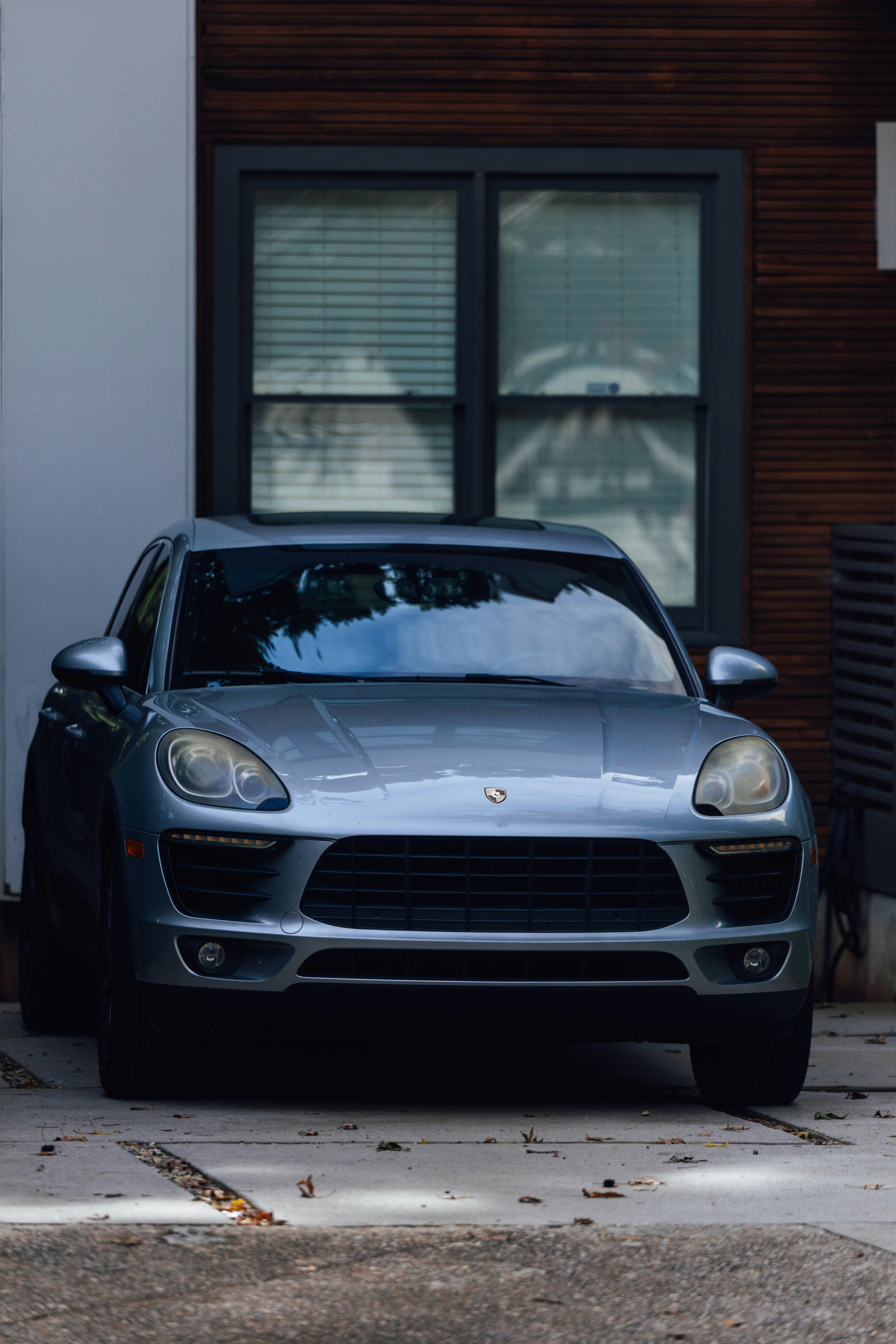 Silvery Porsche at Dusk: Street-Front Still