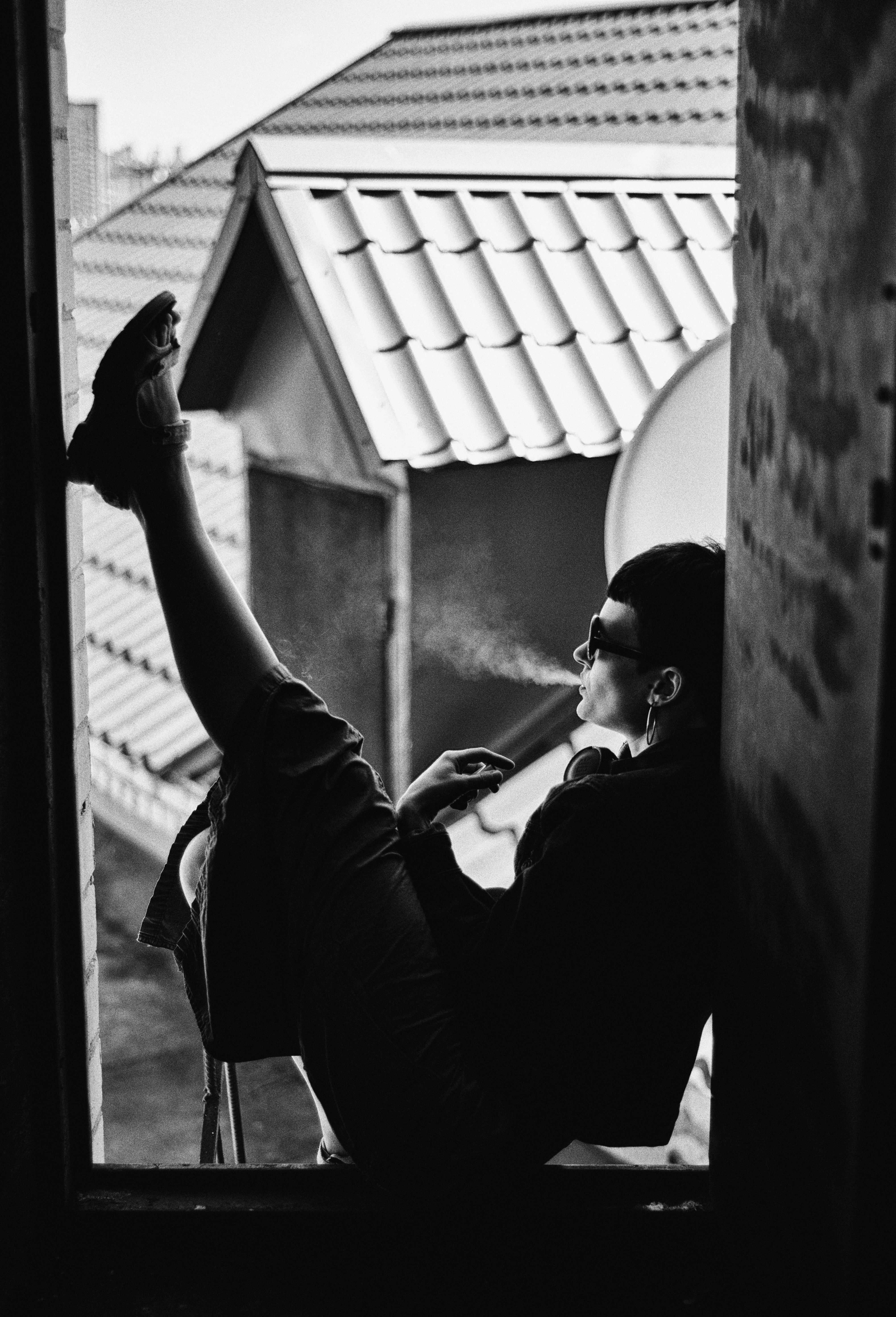 Smoke and Silence: A Rooftop Portrait in Shadowed Light