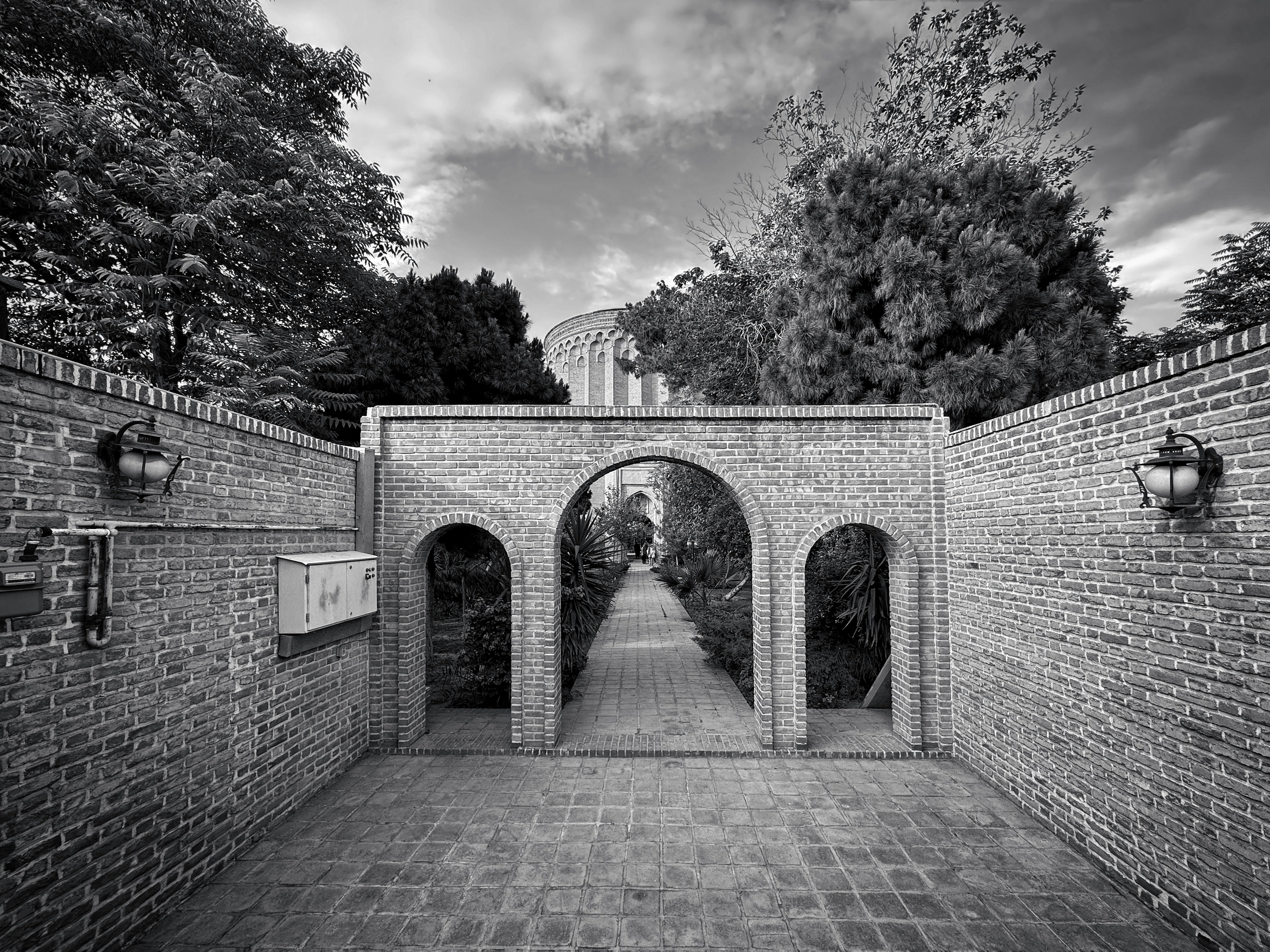 Archway Corridor: Symmetry Through Brick and Light