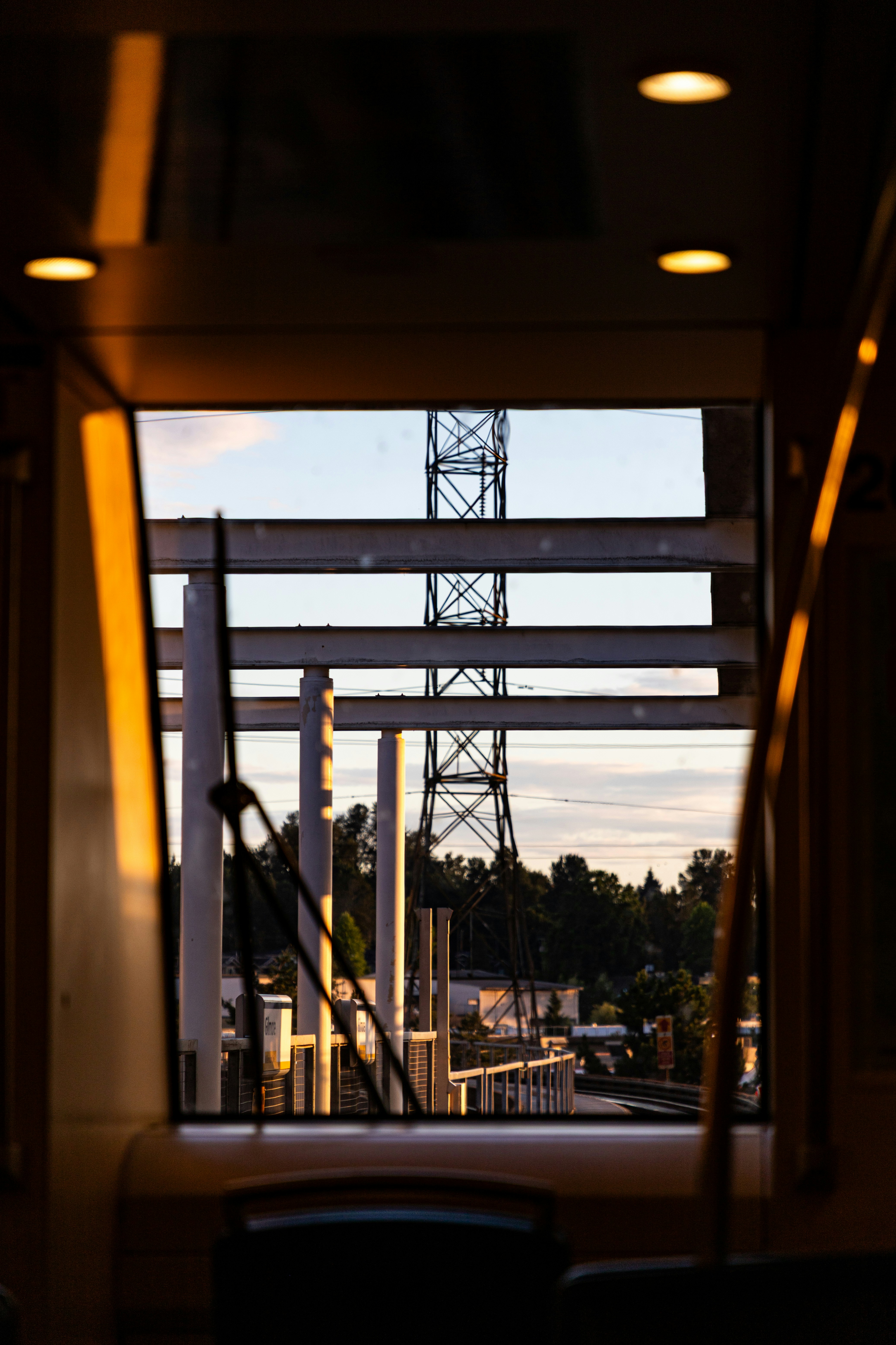 Sunlit Cathedral of Steel: Framing the Yard from a Train Window