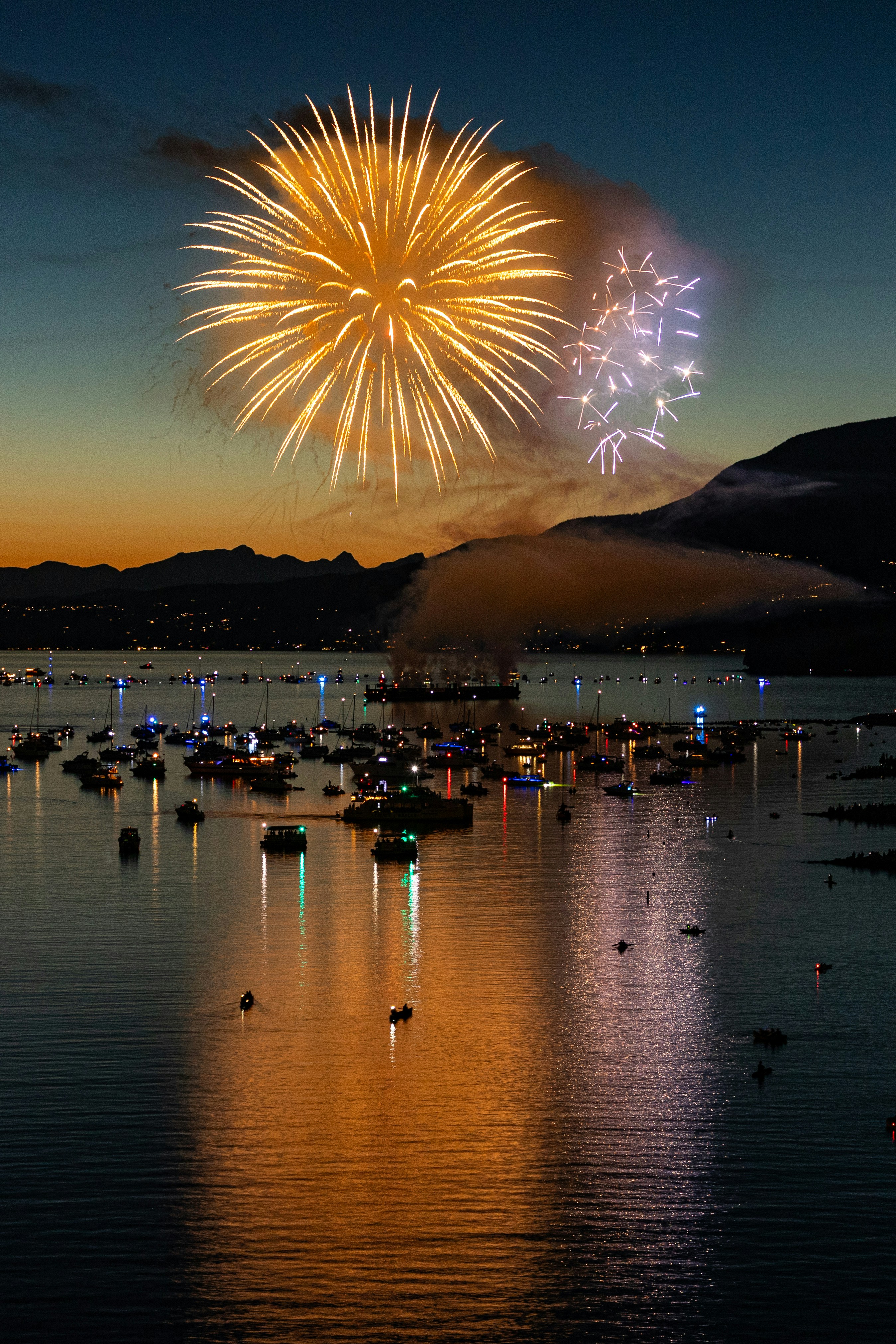 Nightfall Fireworks Over a Harbor Lagoon