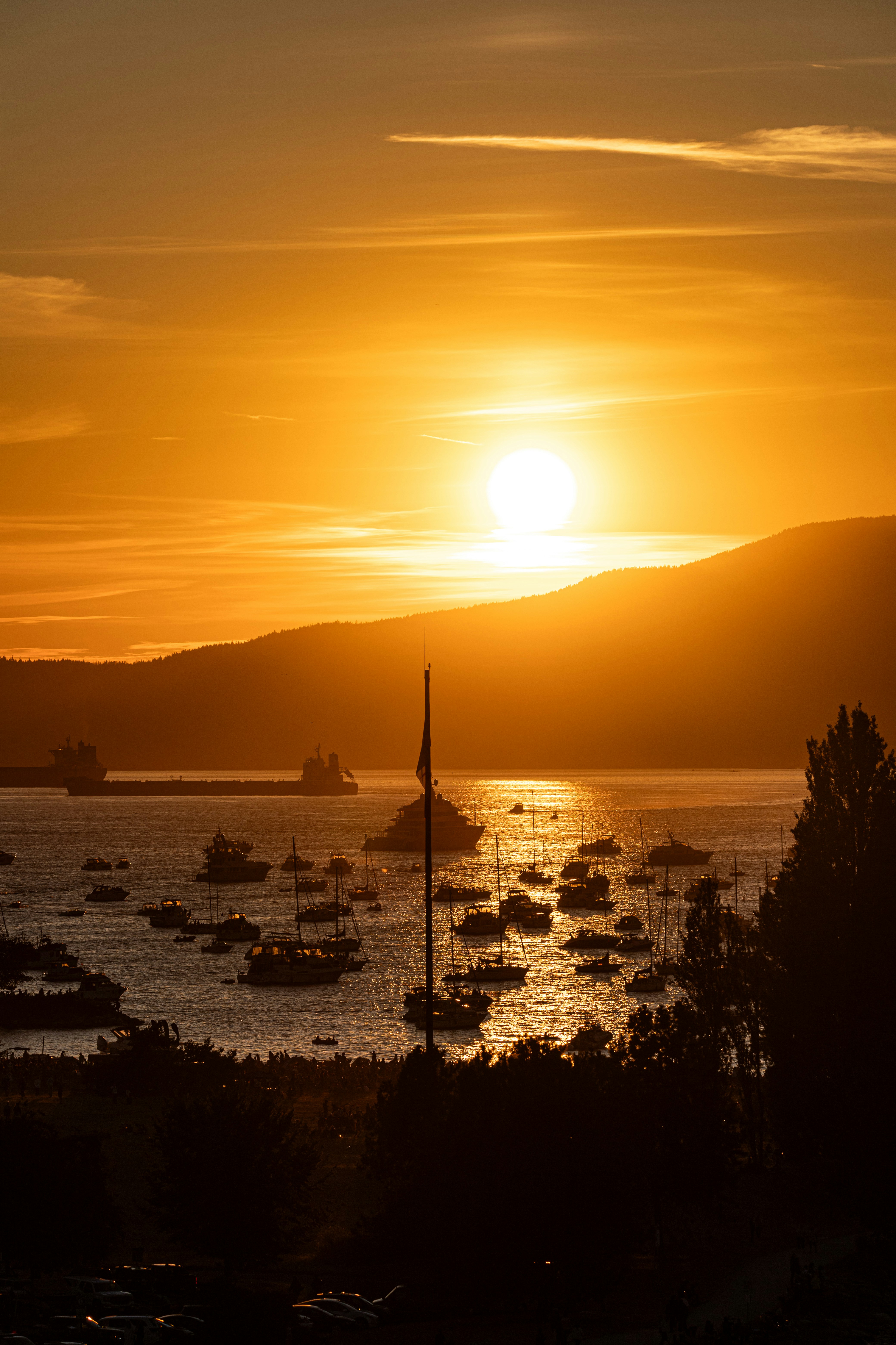 Solar Sea: Boats Beside the Glowing Horizon at Sunset