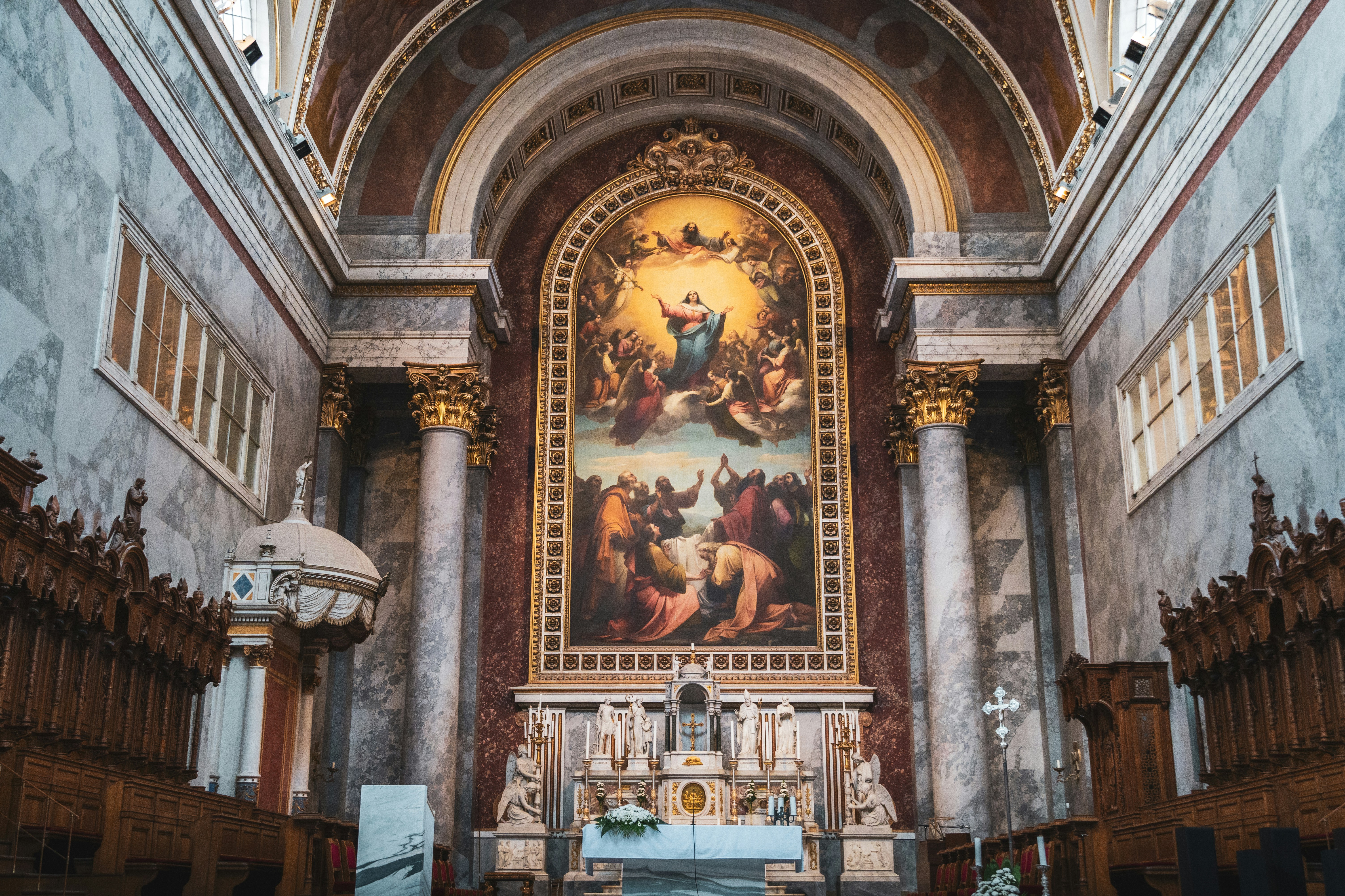 The Sacred Altarpiece: A Majestic Cathedral Altar Framed by Marble Aisles