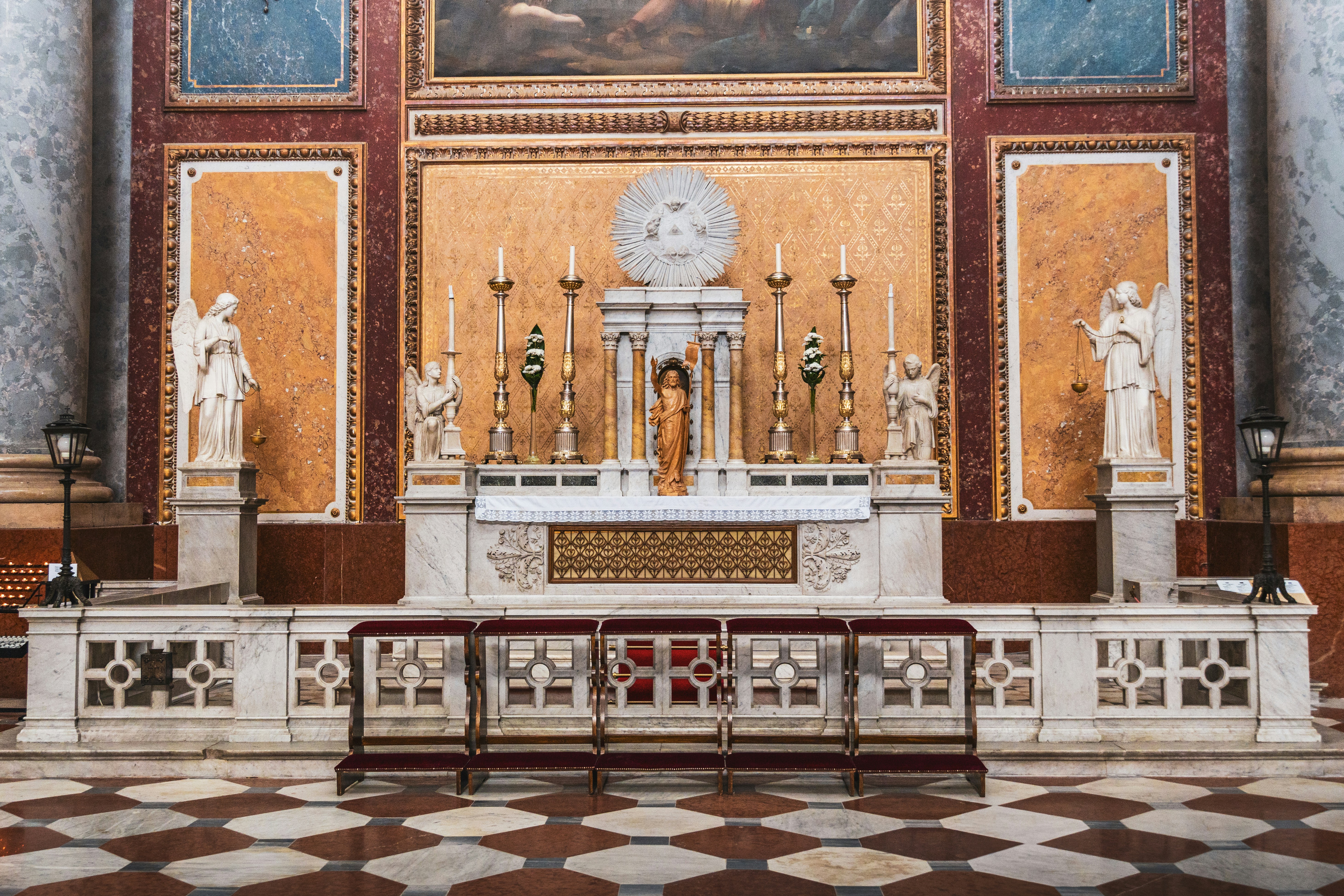 Altar of Reverence: A Marble Terrace Framed by Statues and Candles