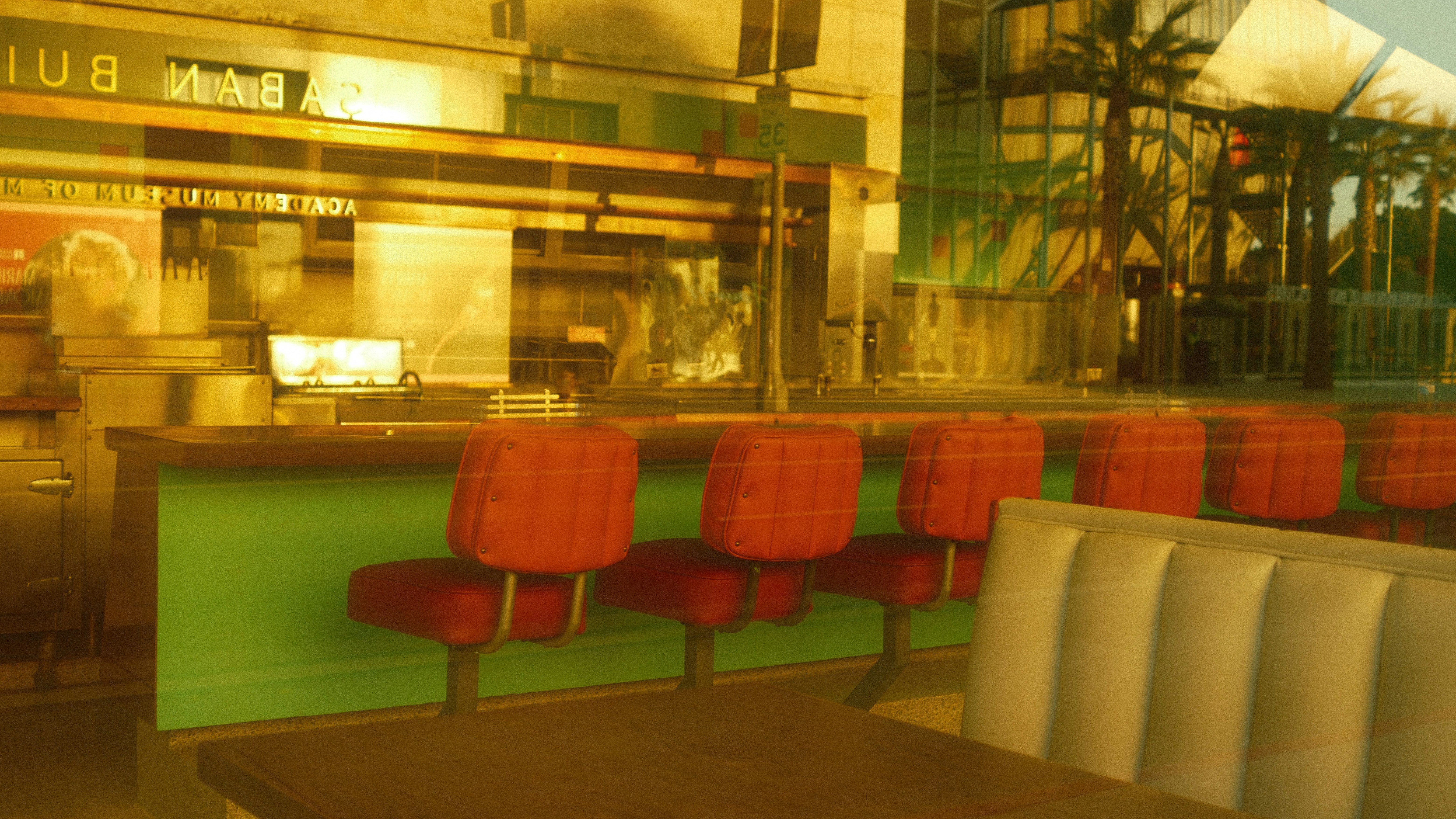 Golden Glimpses Through an Old Diner Window