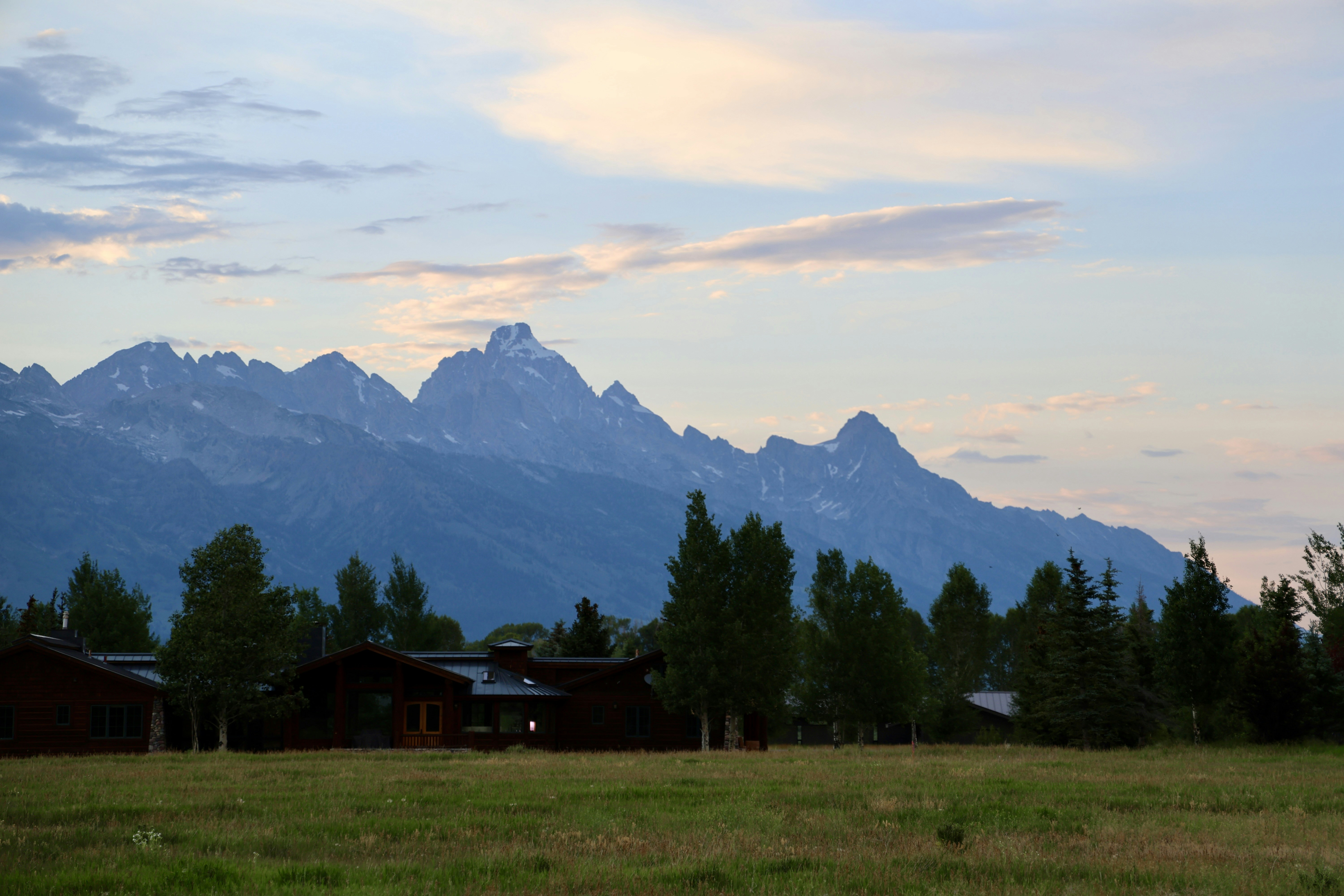 Twilight Range: A Quiet Meadow Beneath Snowy Peaks