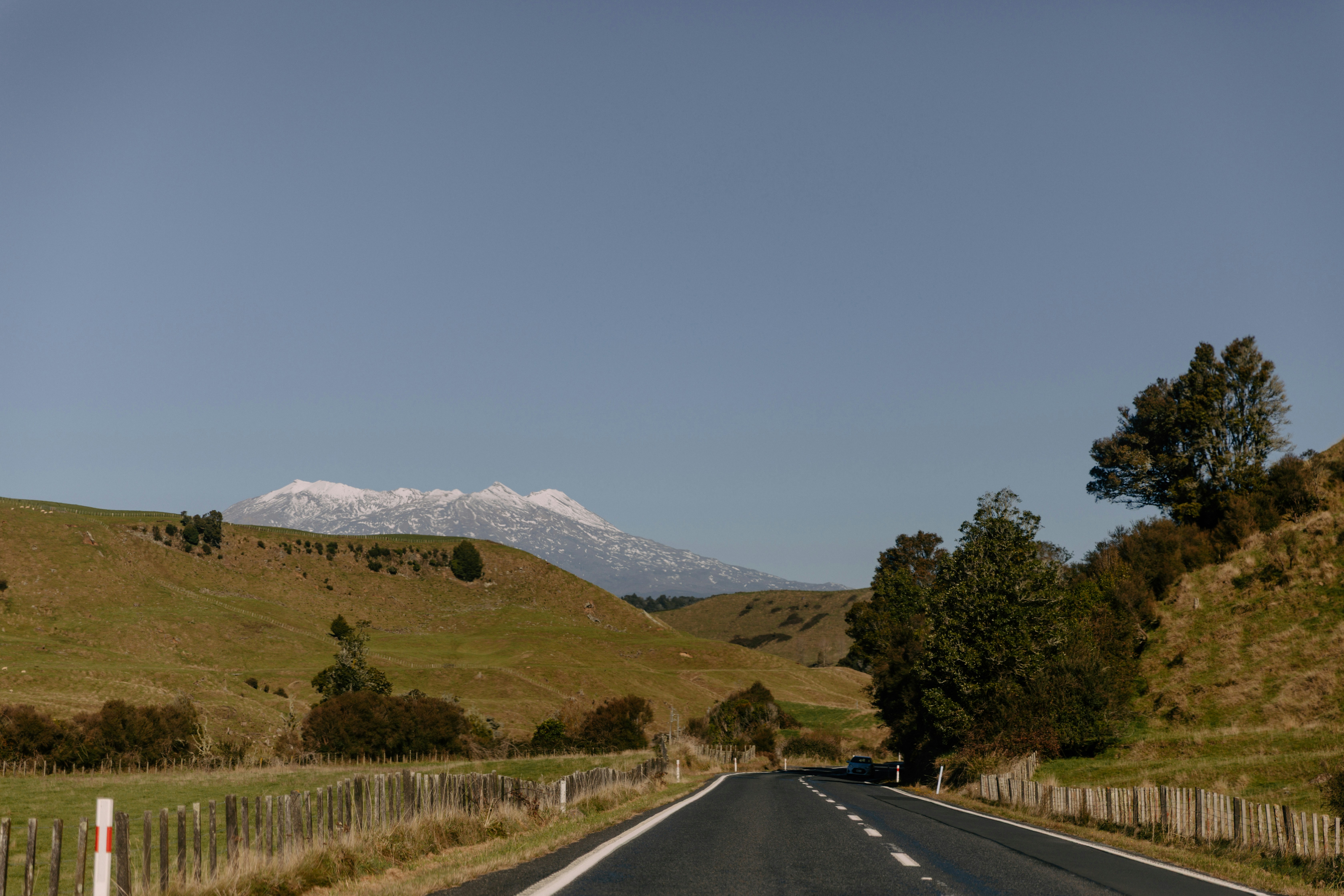 Open Road to Snow-Capped Peaks