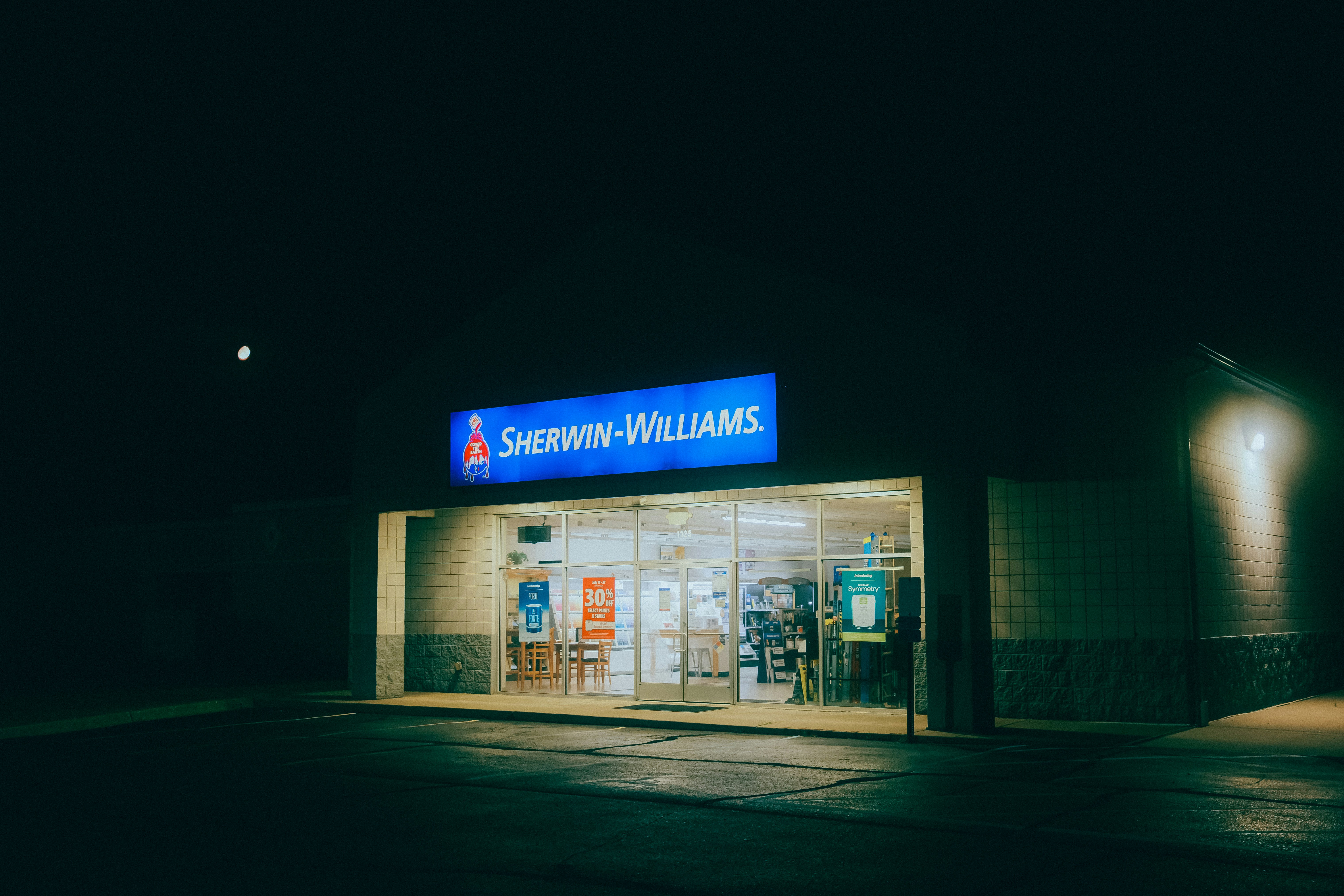 Neon Blue at the Entrance: Dark Convenience Store Night