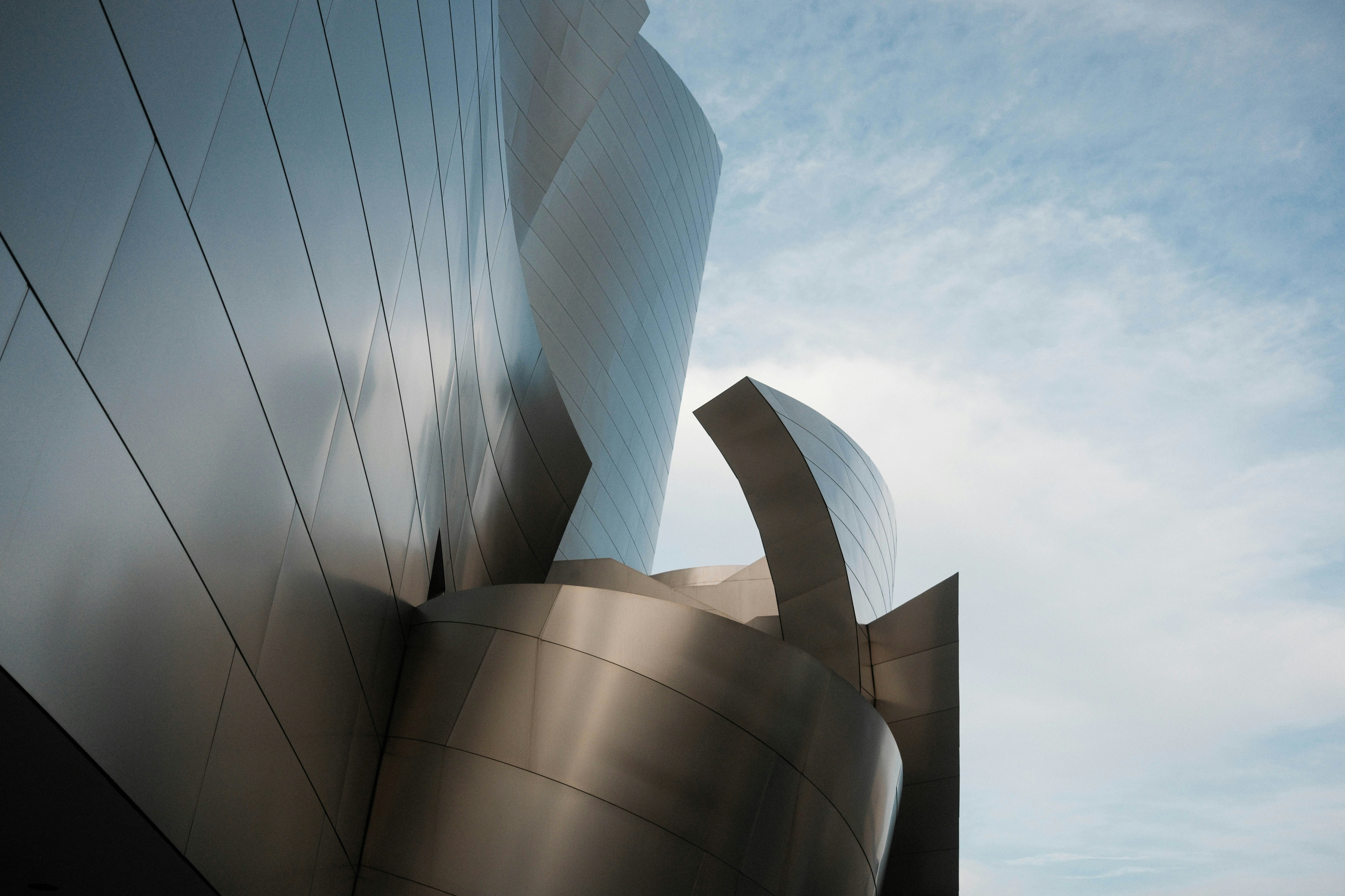 Curved Steel Symphony against a Clear Sky