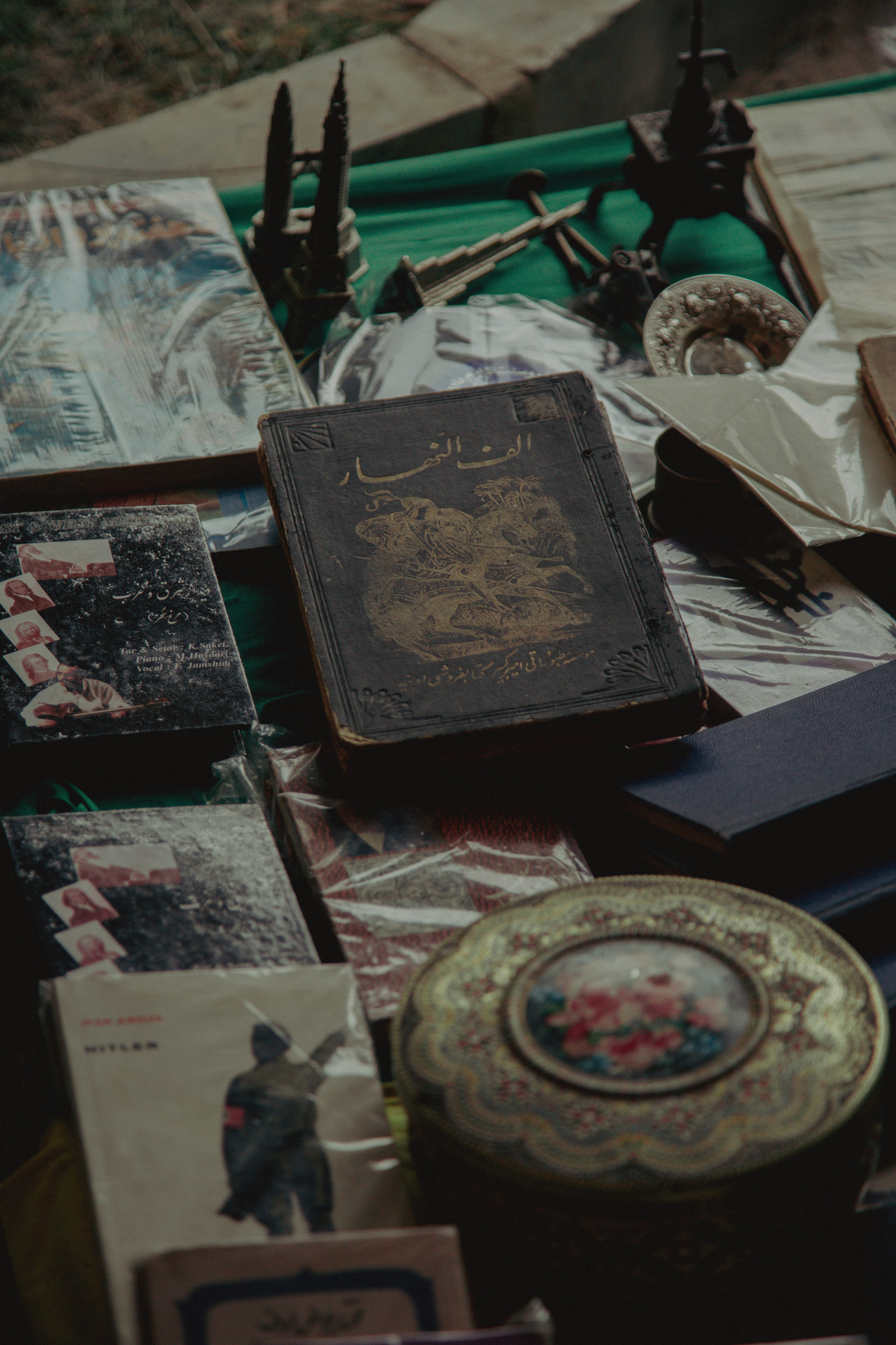 The Quiet Bazaar: Vintage Memorabilia on a Weathered Table