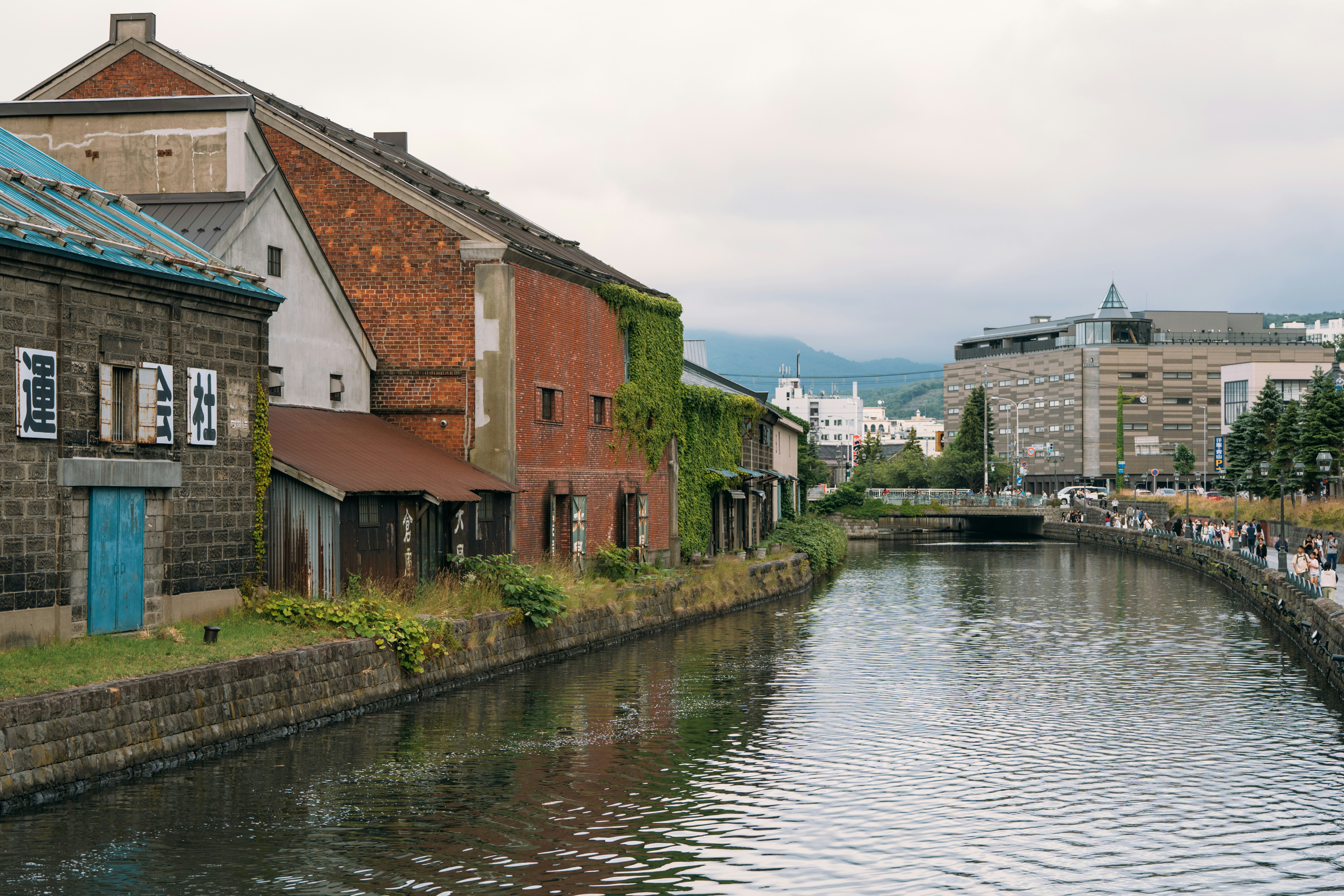 Old Wharf, Quiet Riverbend: A Row of Brick and Stone Buildings by the Water