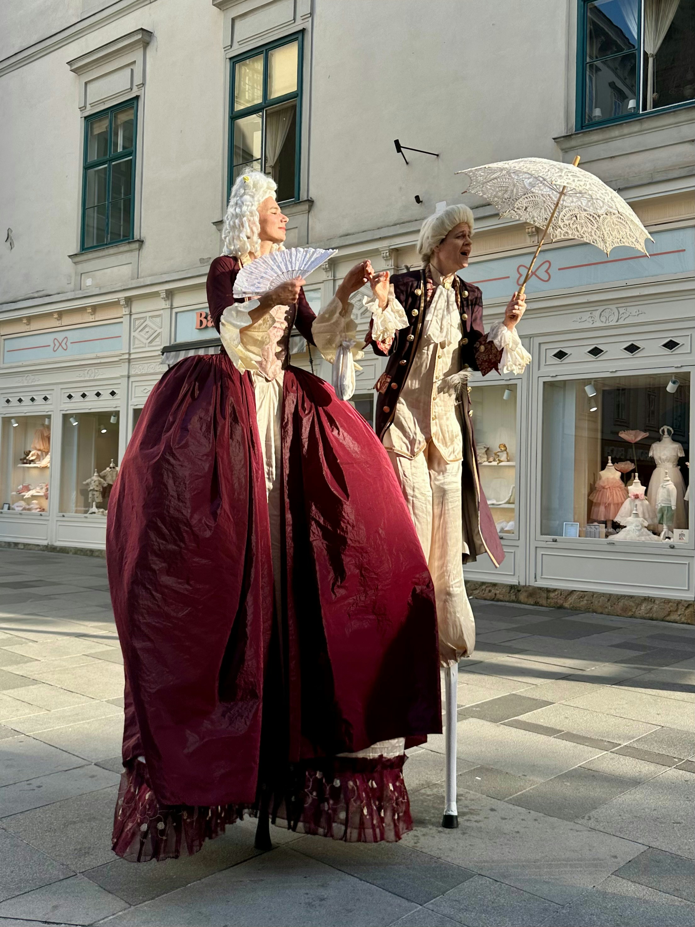 Baroque Carriers: Dueling Elegance on the Cobbled Street