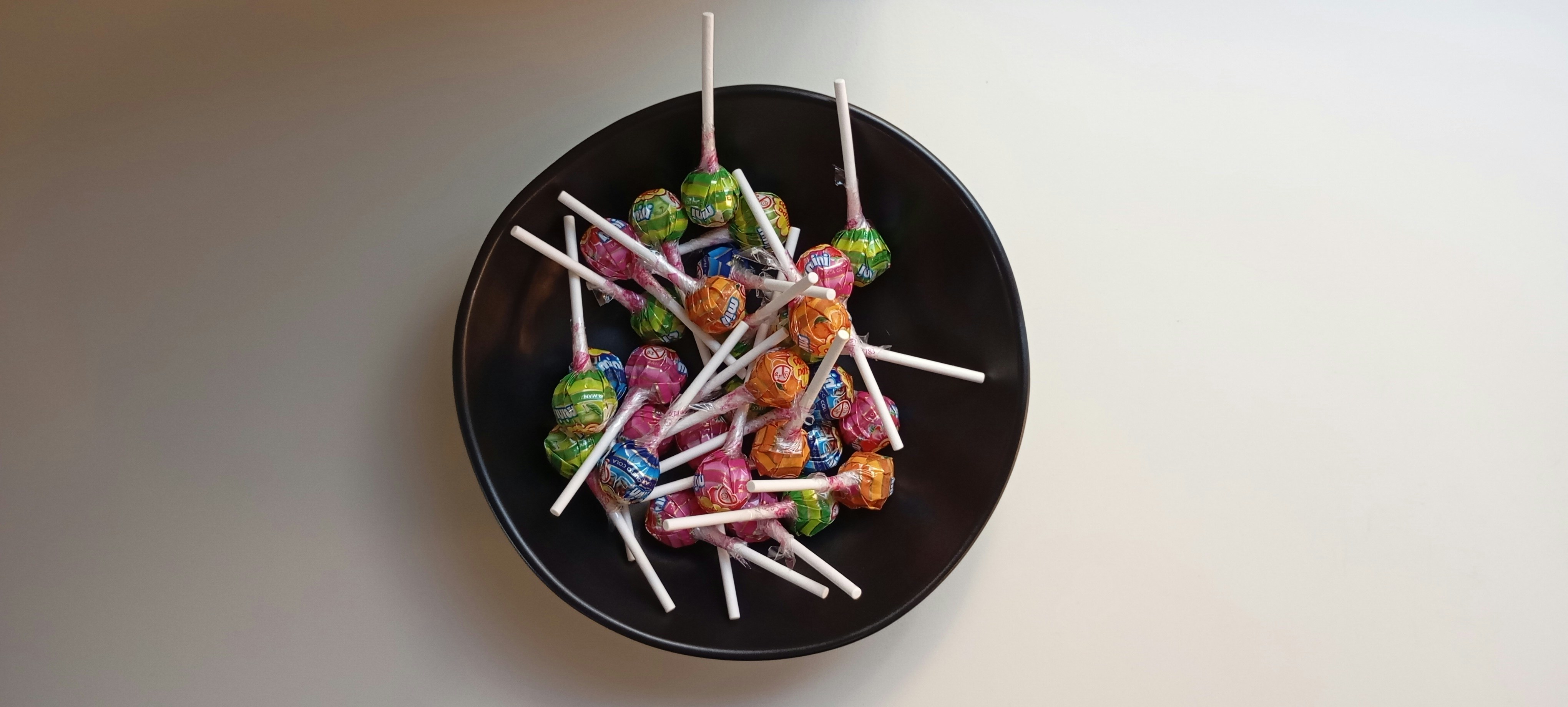 Candy Crush: A Bowl of Lollipops and Straws as Edible Confetti