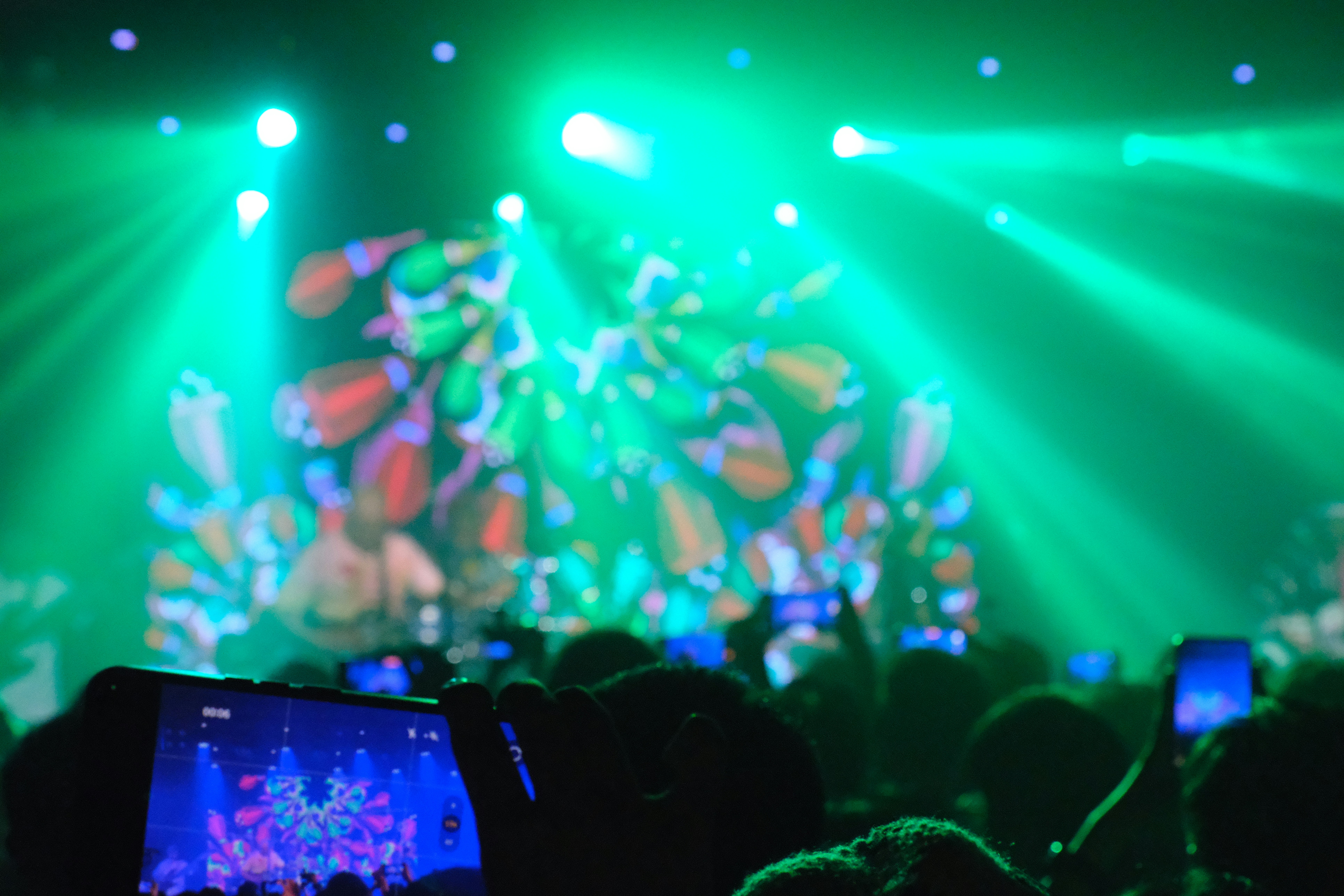 Neon Reverie: Blurred Crowd Beneath a Fluorescent Storm