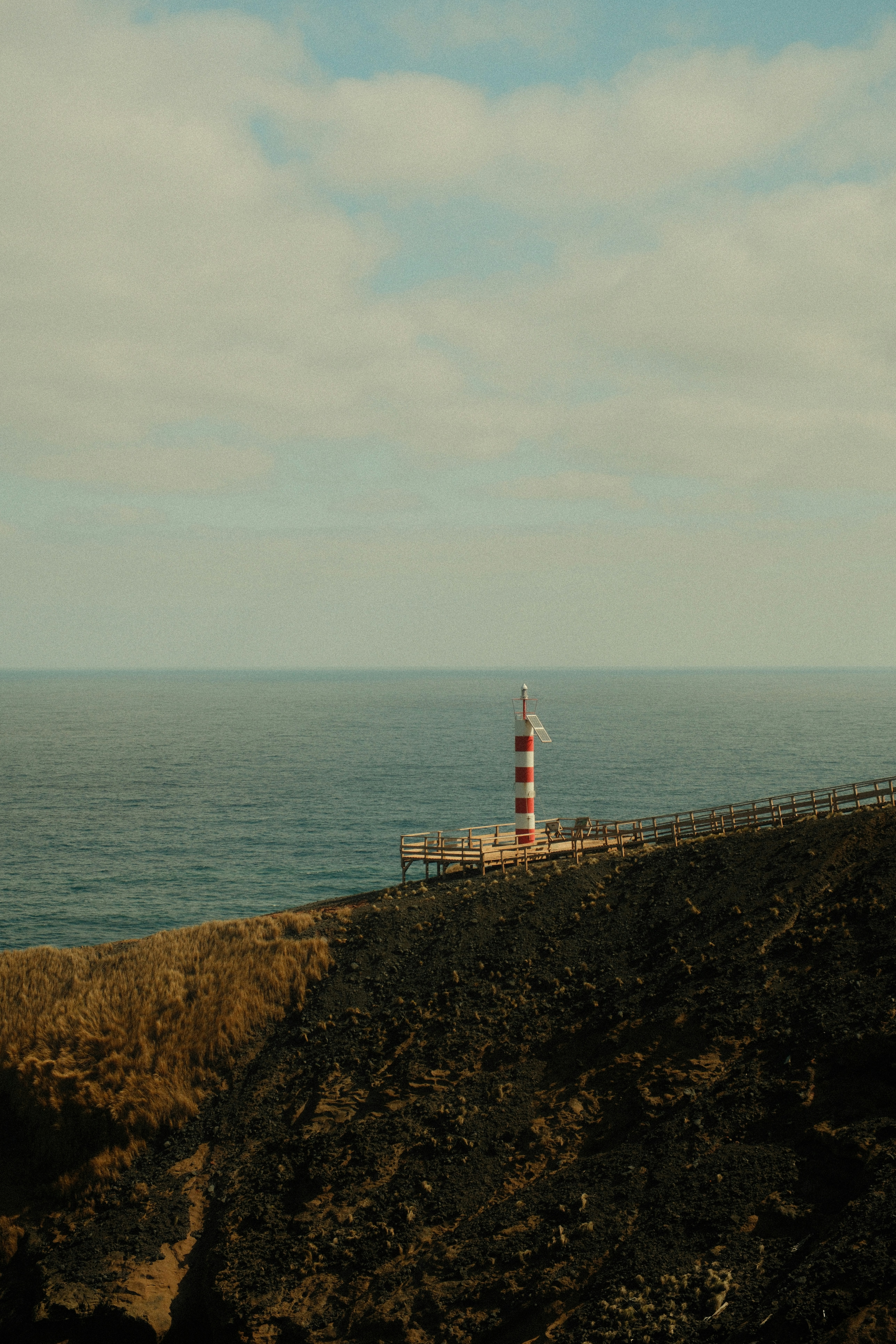 Lighthouse Sentinel at the Cliff Edge