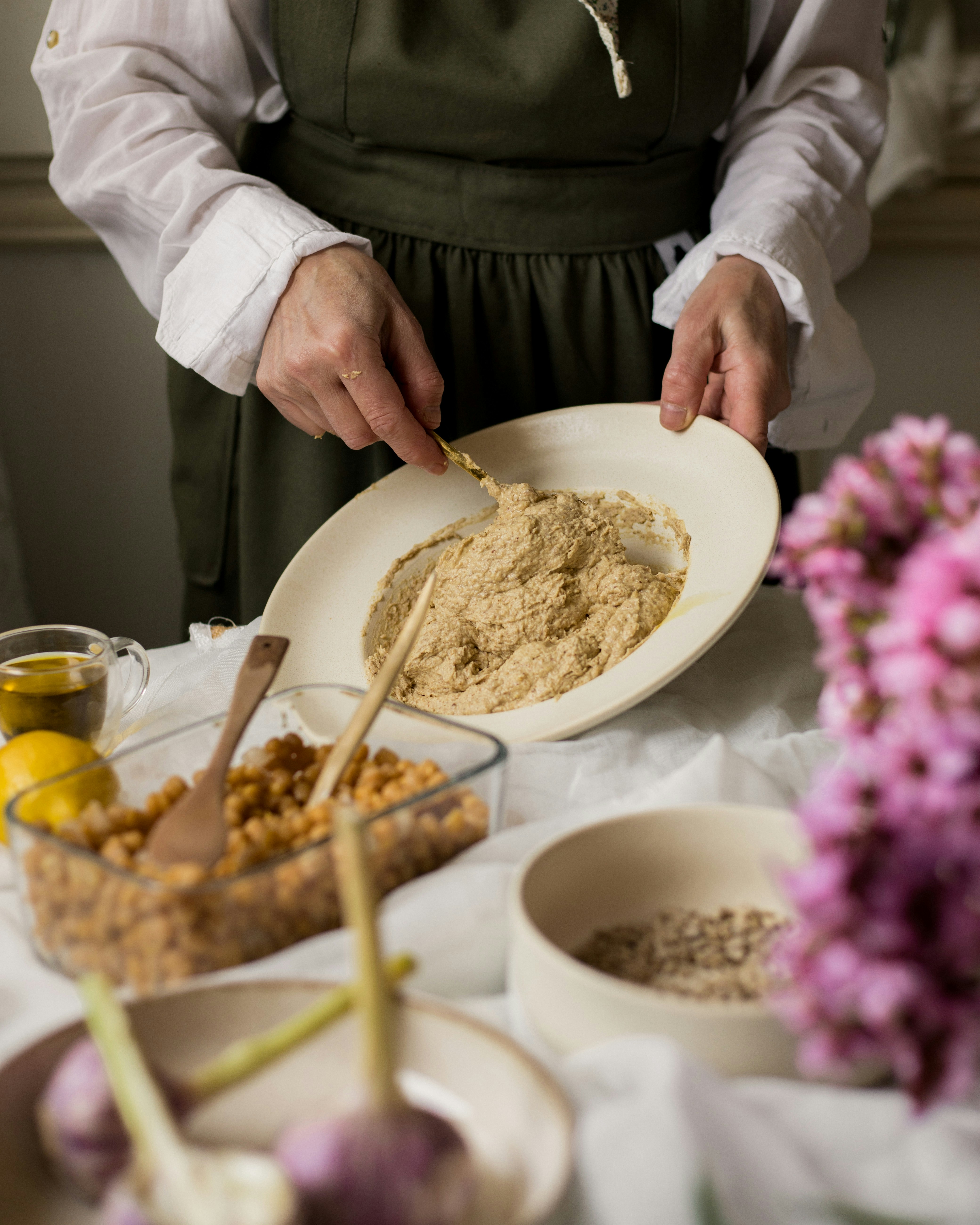 Hands at Work: Dusting Flour Over a Rustic Kitchen Prep Scene