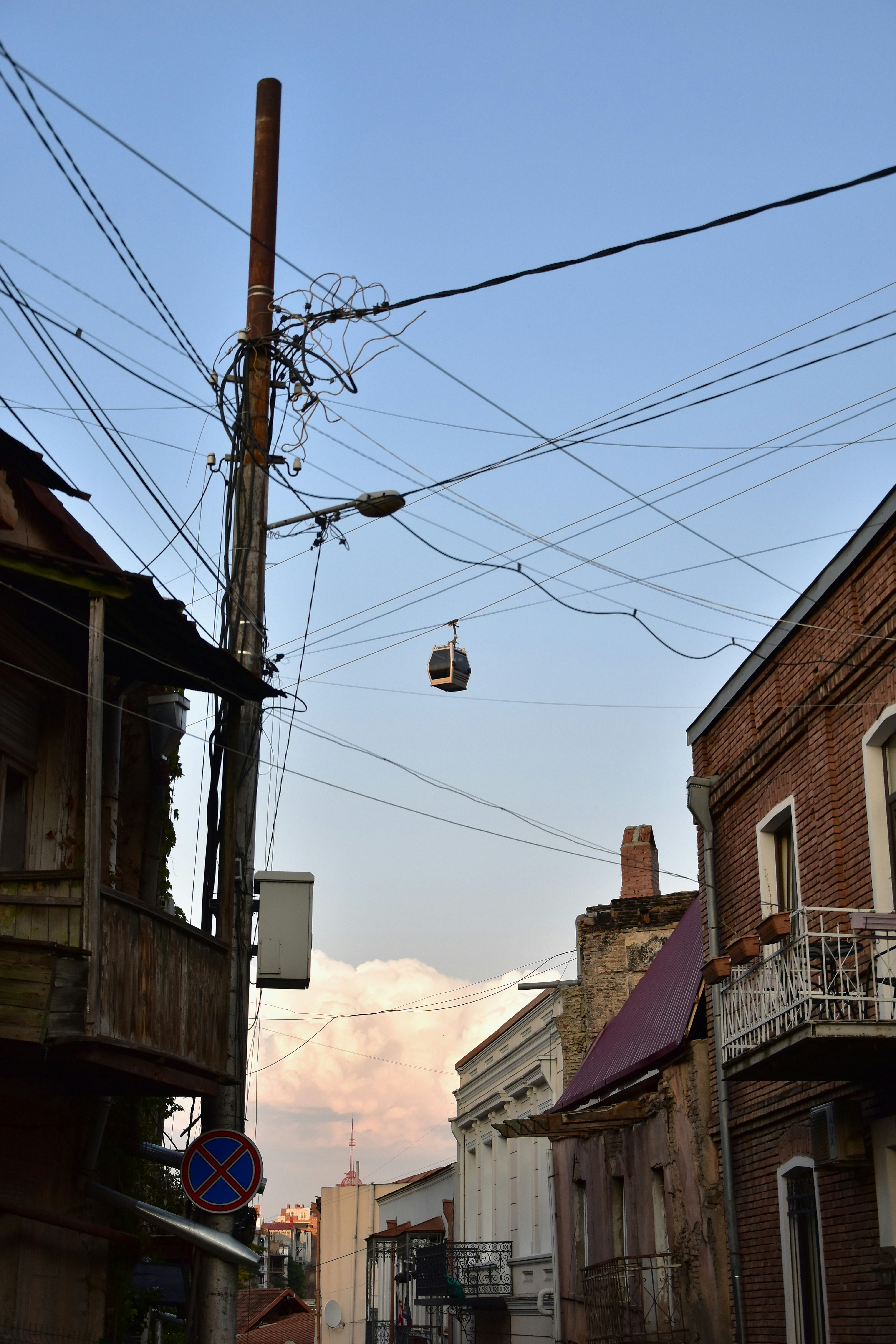 Tangled Cables Above a Quiet Street
