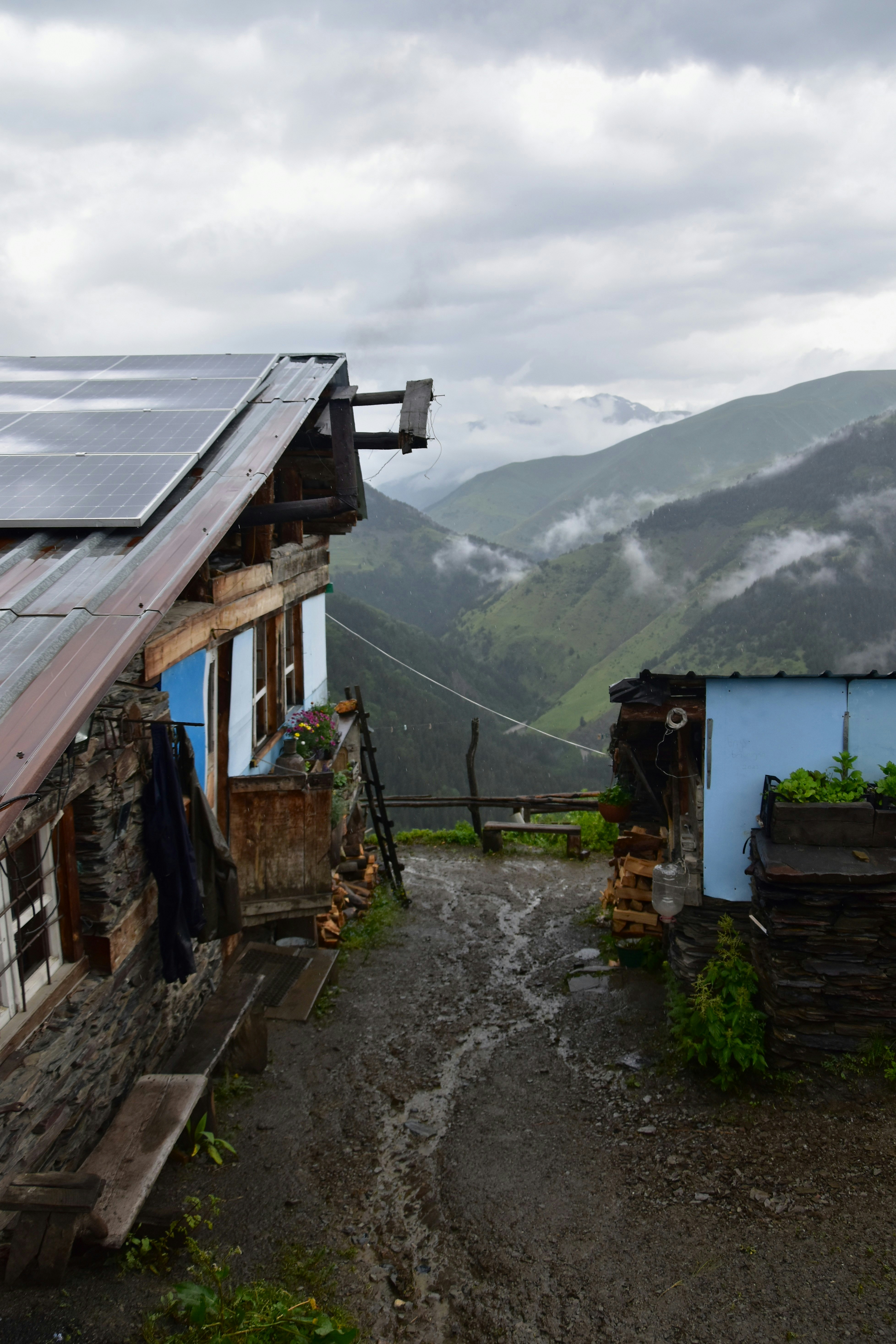 Ridgetop Courtyard: A Mountain Village Path Between Weathered Roofs