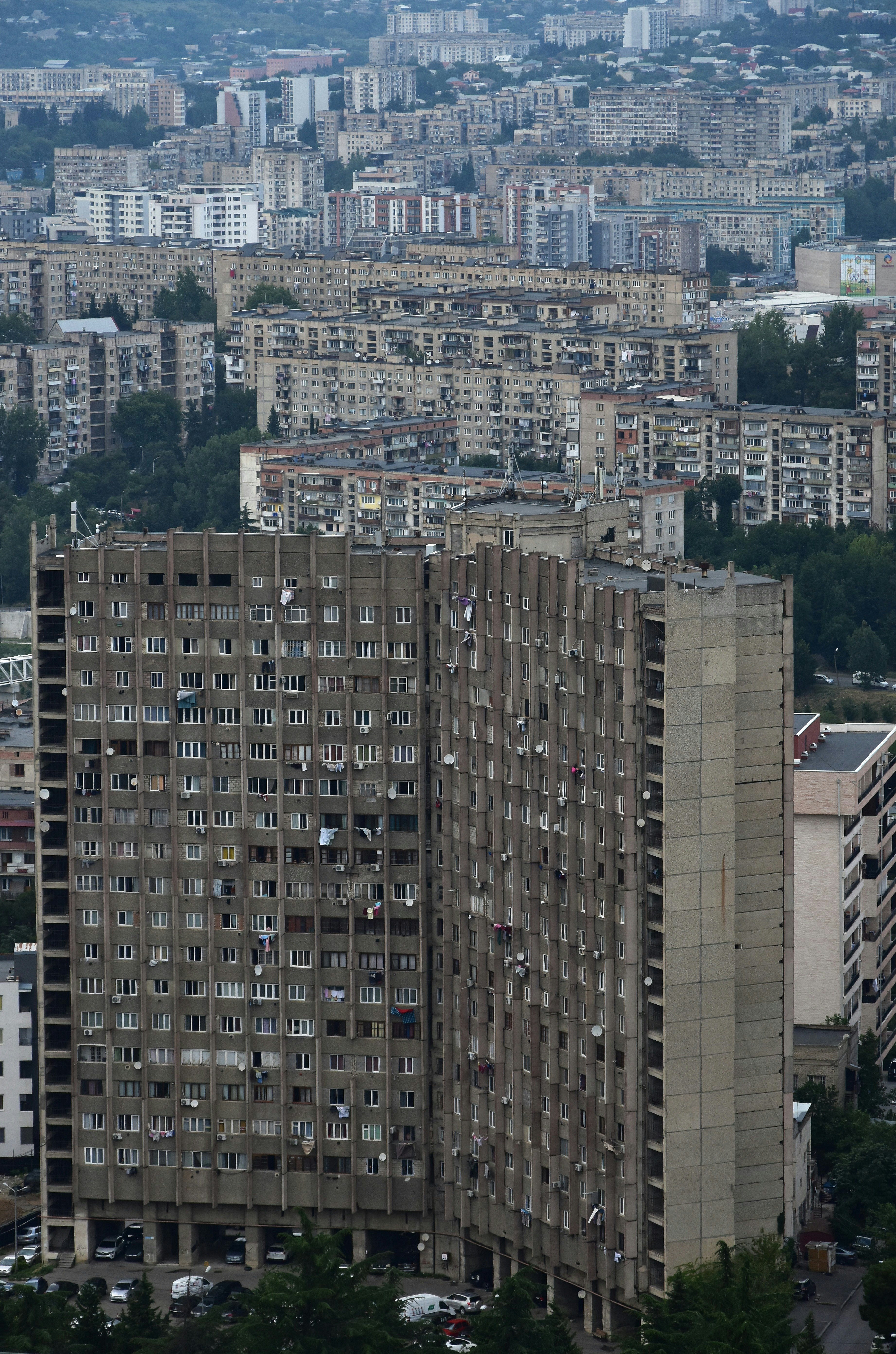 Concrete Canyon: A Sea of Windows in a Dense Urban Spine