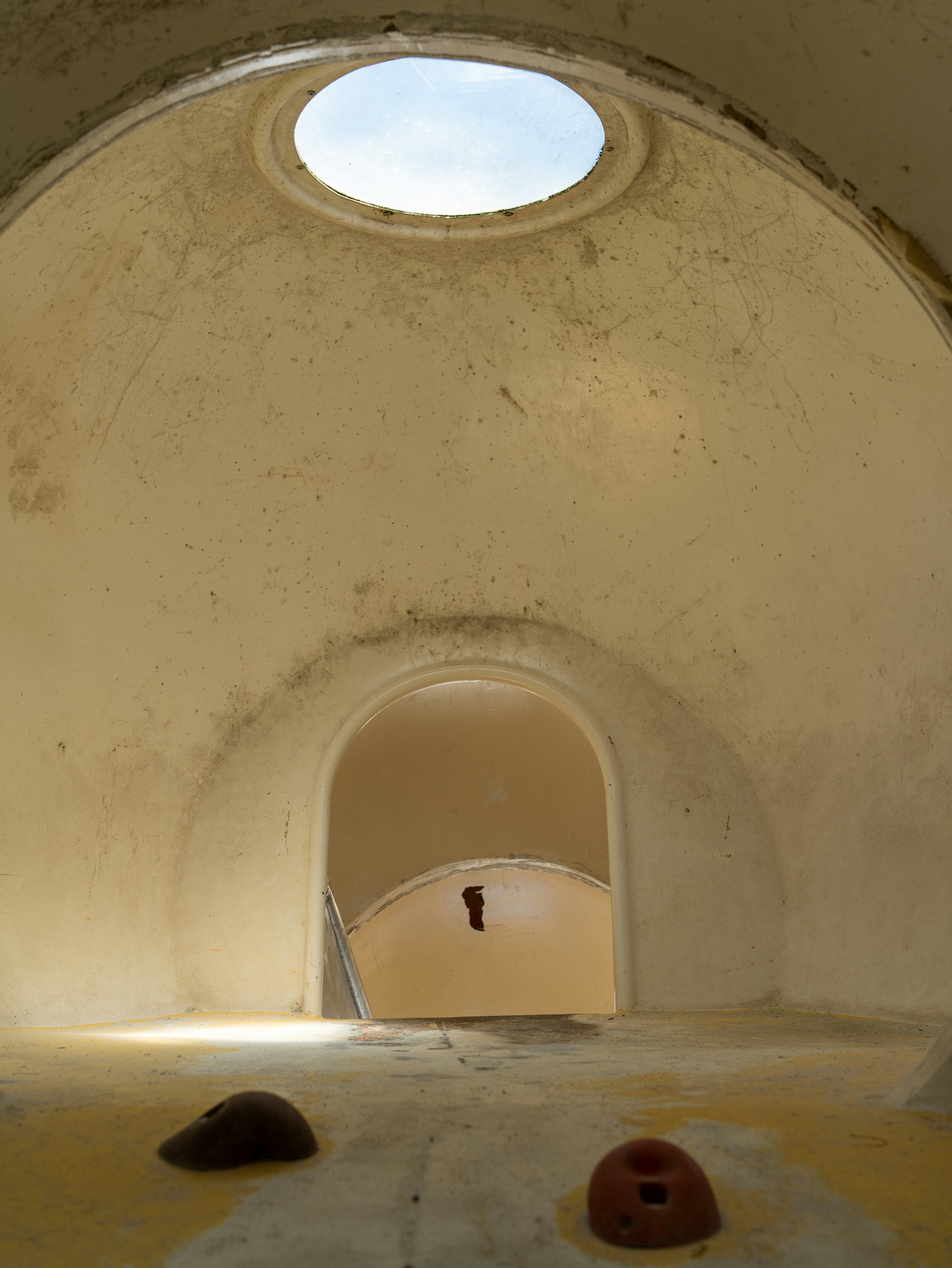 Circular Skylight Over an Echoing Archway in Deserted Interior