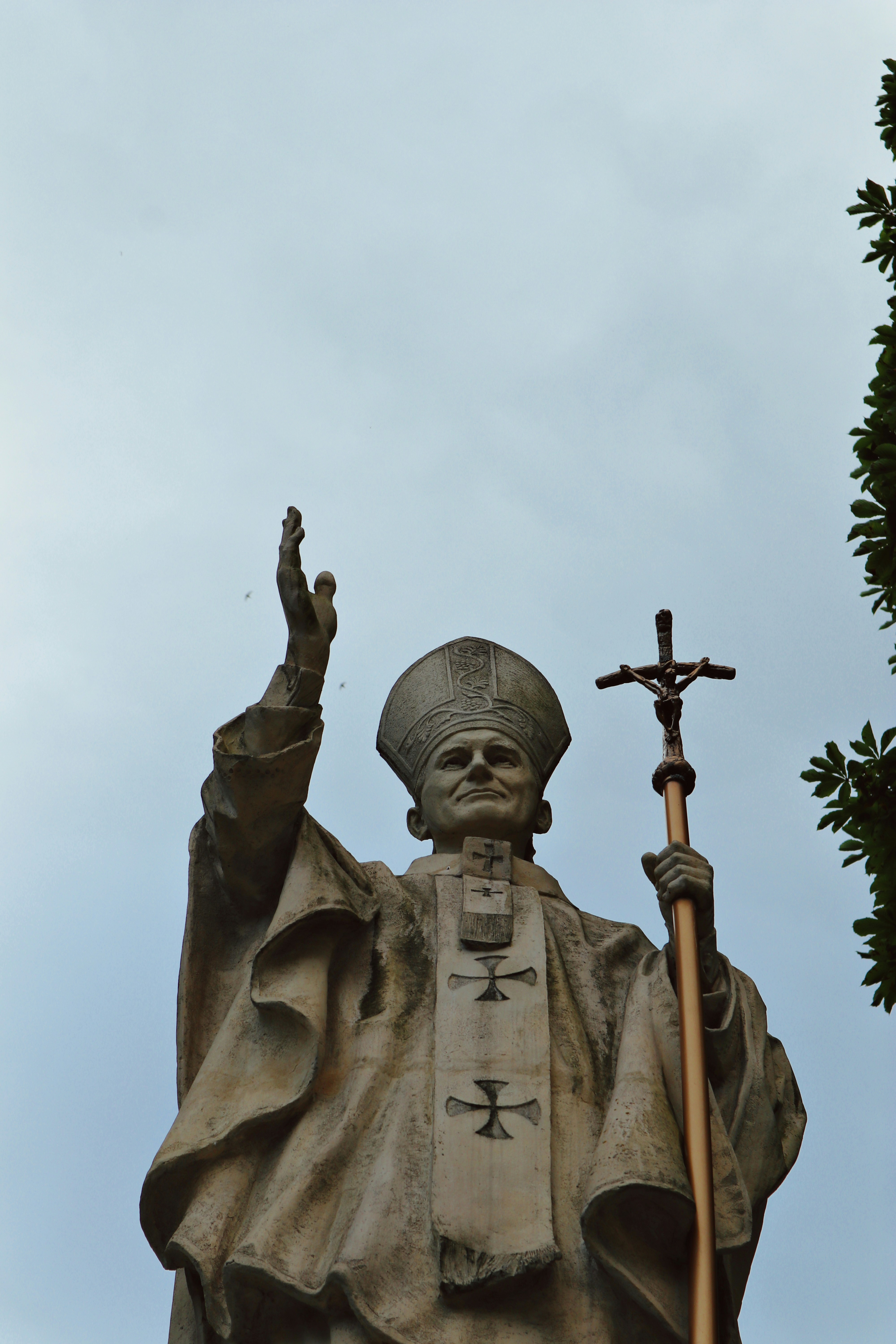 Bishop Ascendant: A Statuesque Gesture Against a Clear Sky