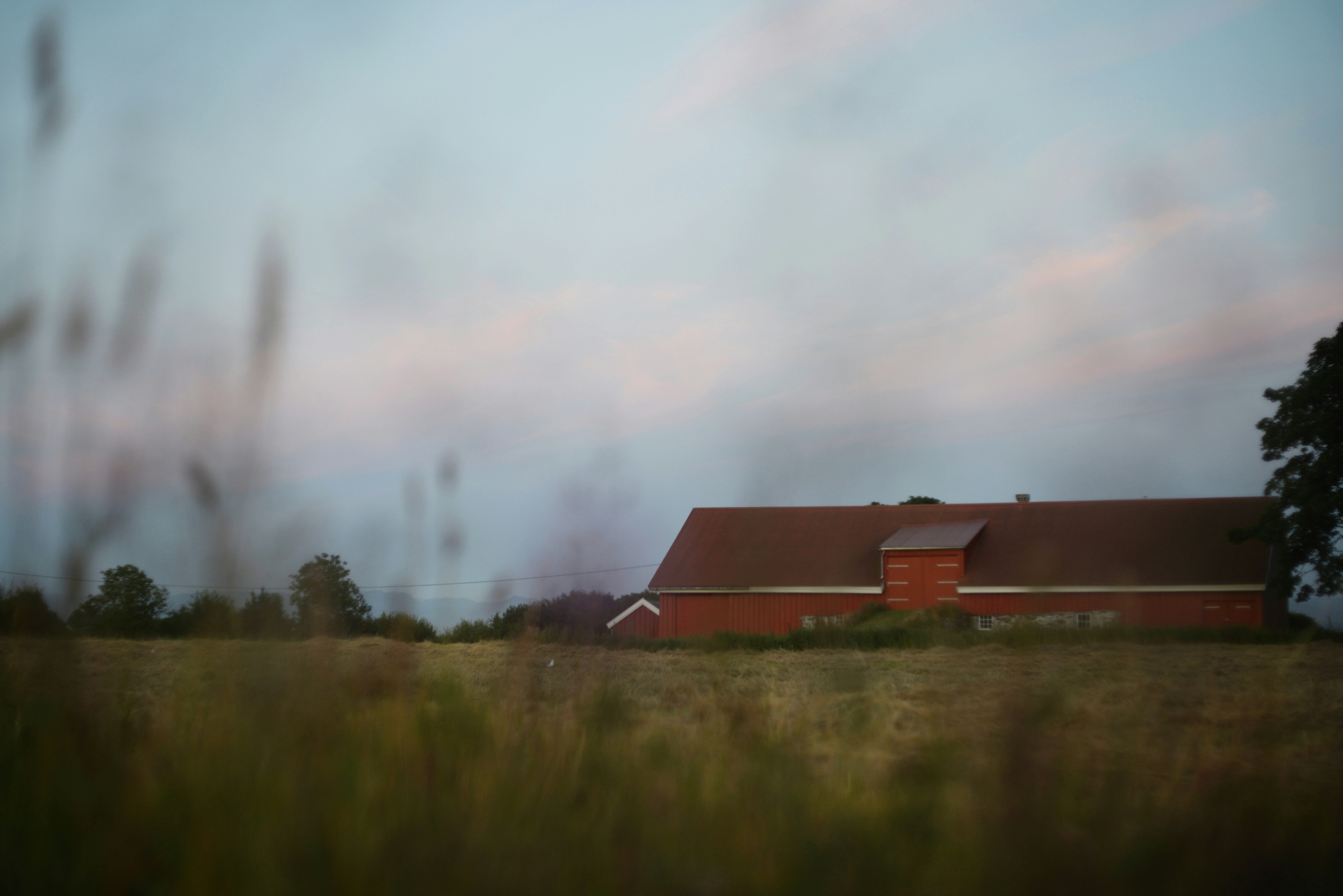 Red Barn Under a Wide Sky at Dusk