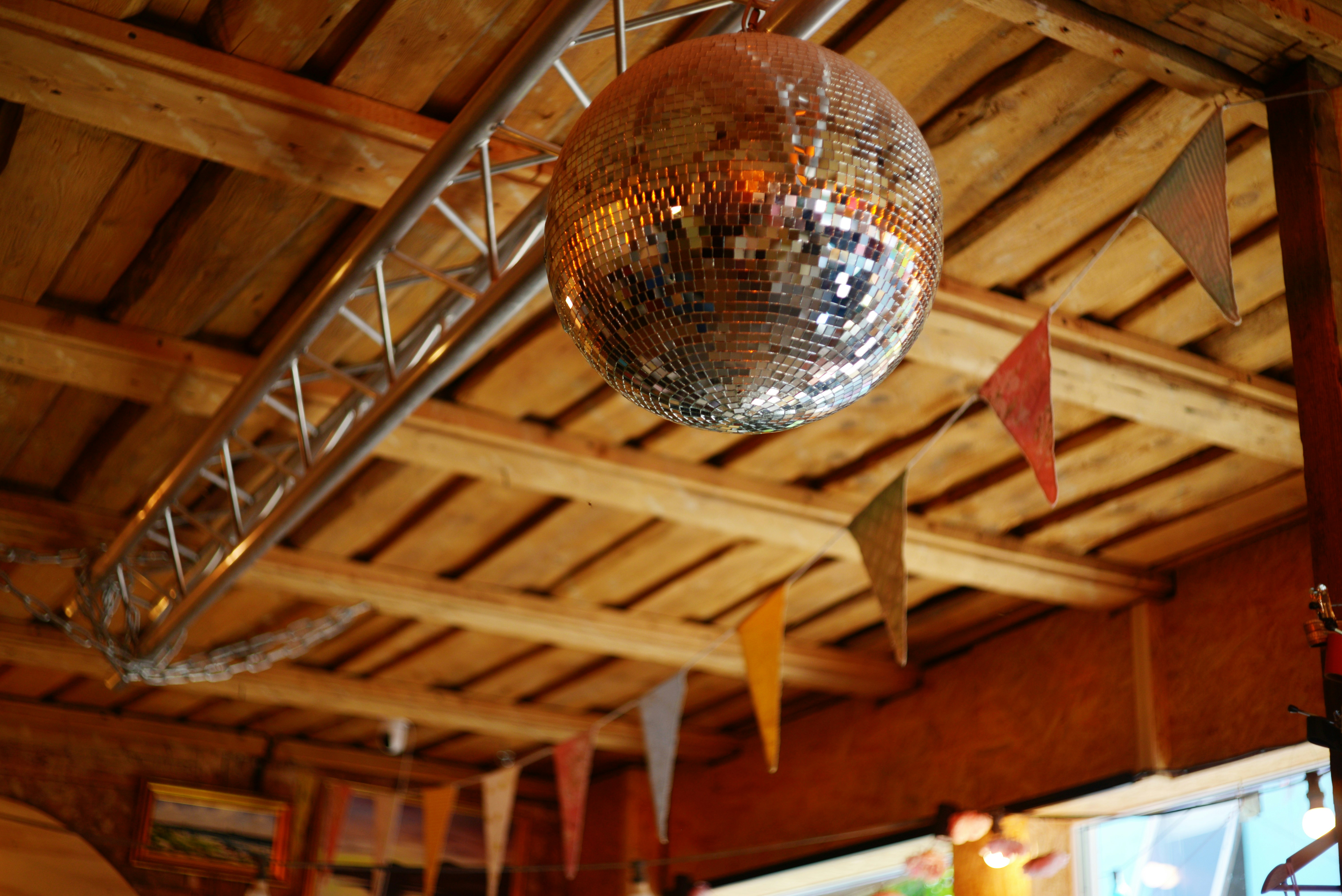 Disco Globe Hovering Above Festive Ceiling