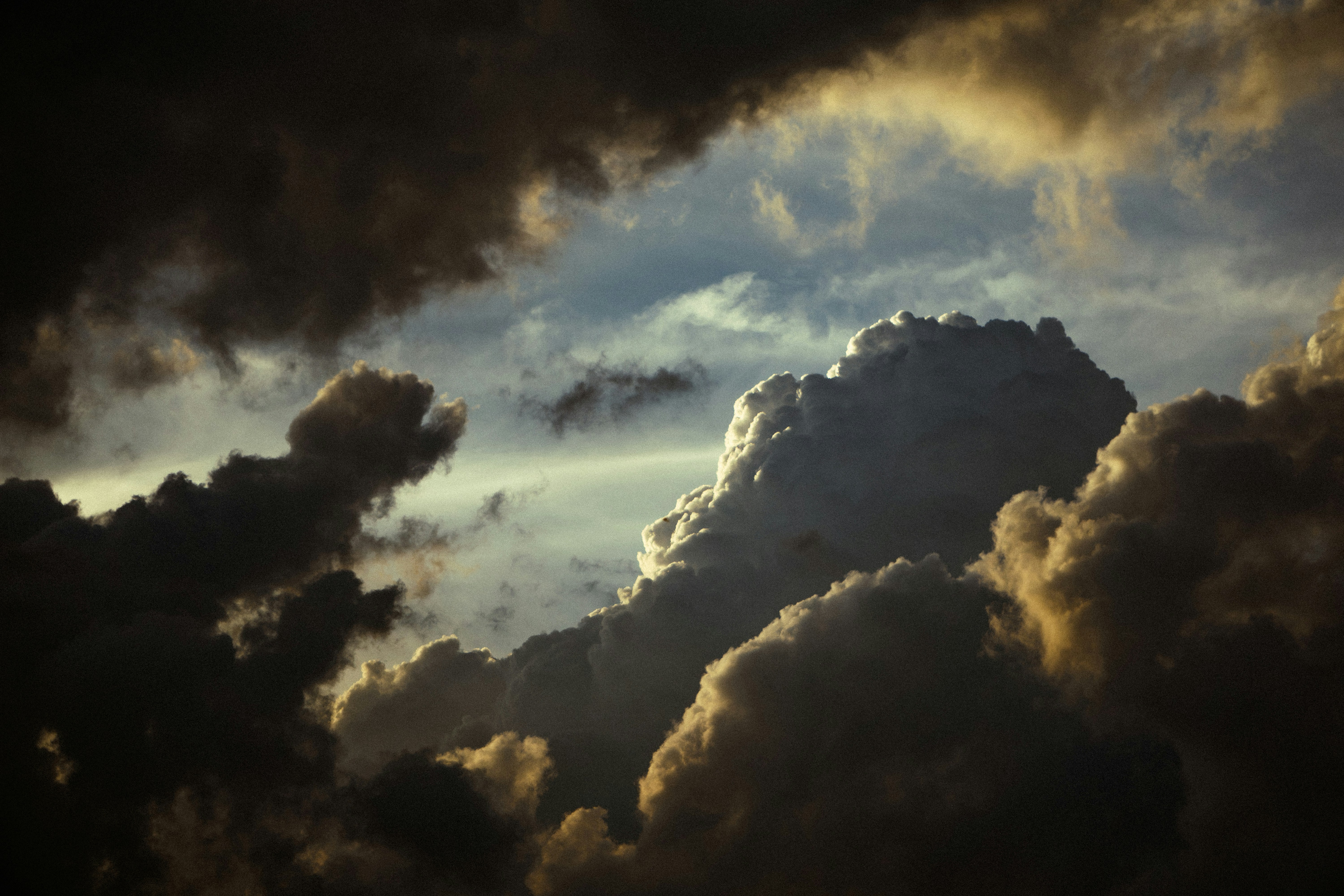 Stand of storm-front clouds with a breakthrough beam