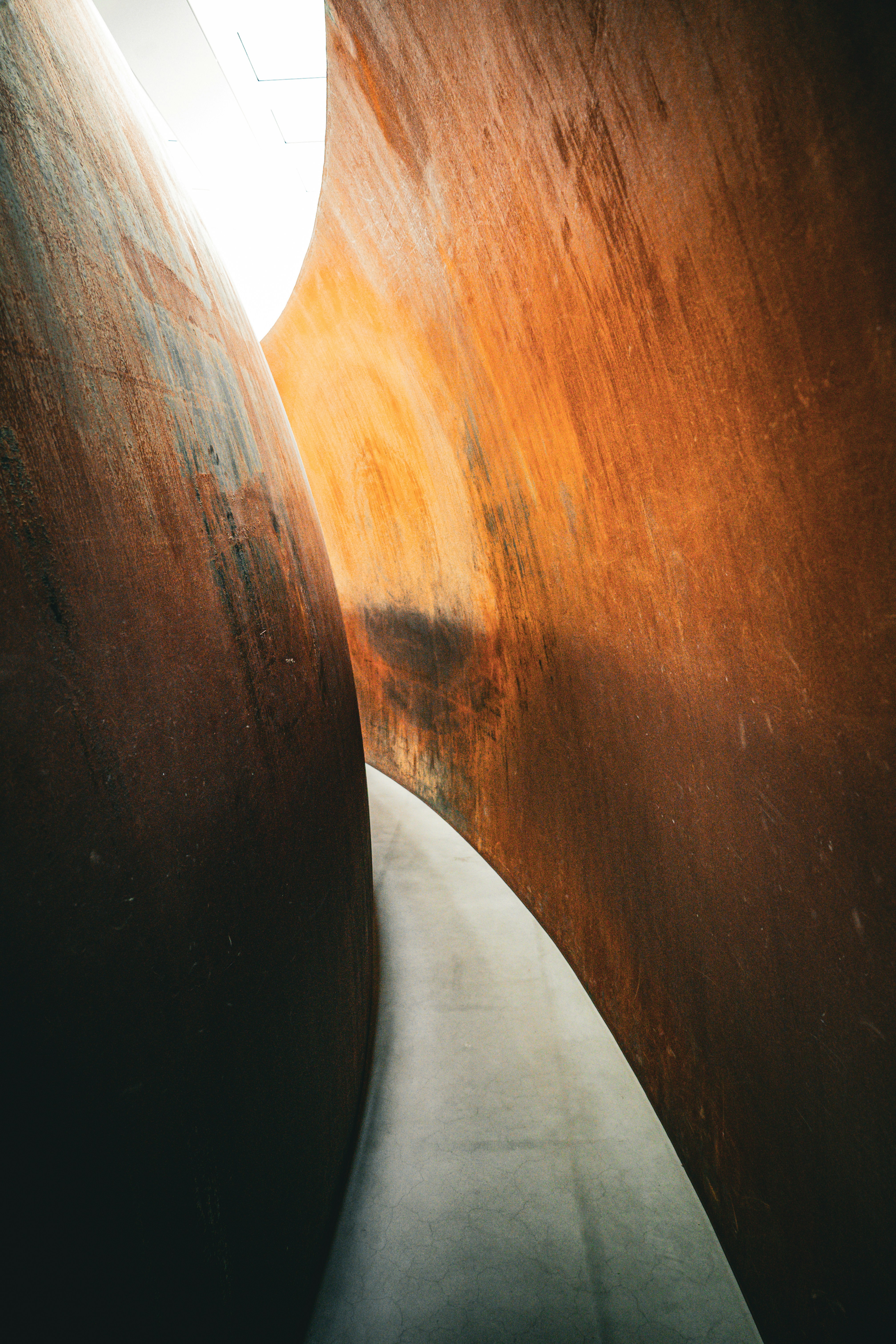 Crescent Canyon: Two Rusted Walls Converging in Warm Light
