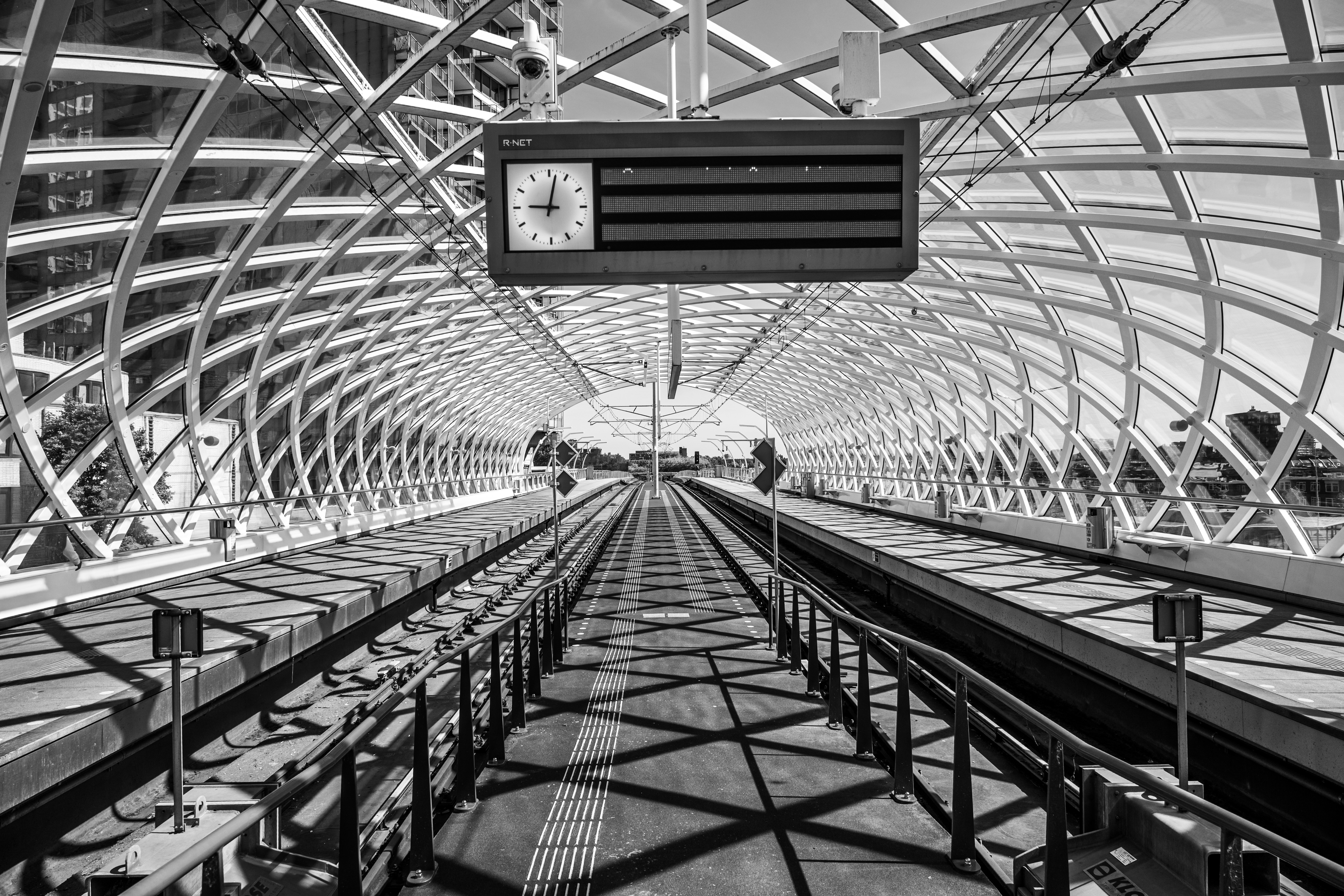 Symmetric Dawn on a Glass-Arc Walkway