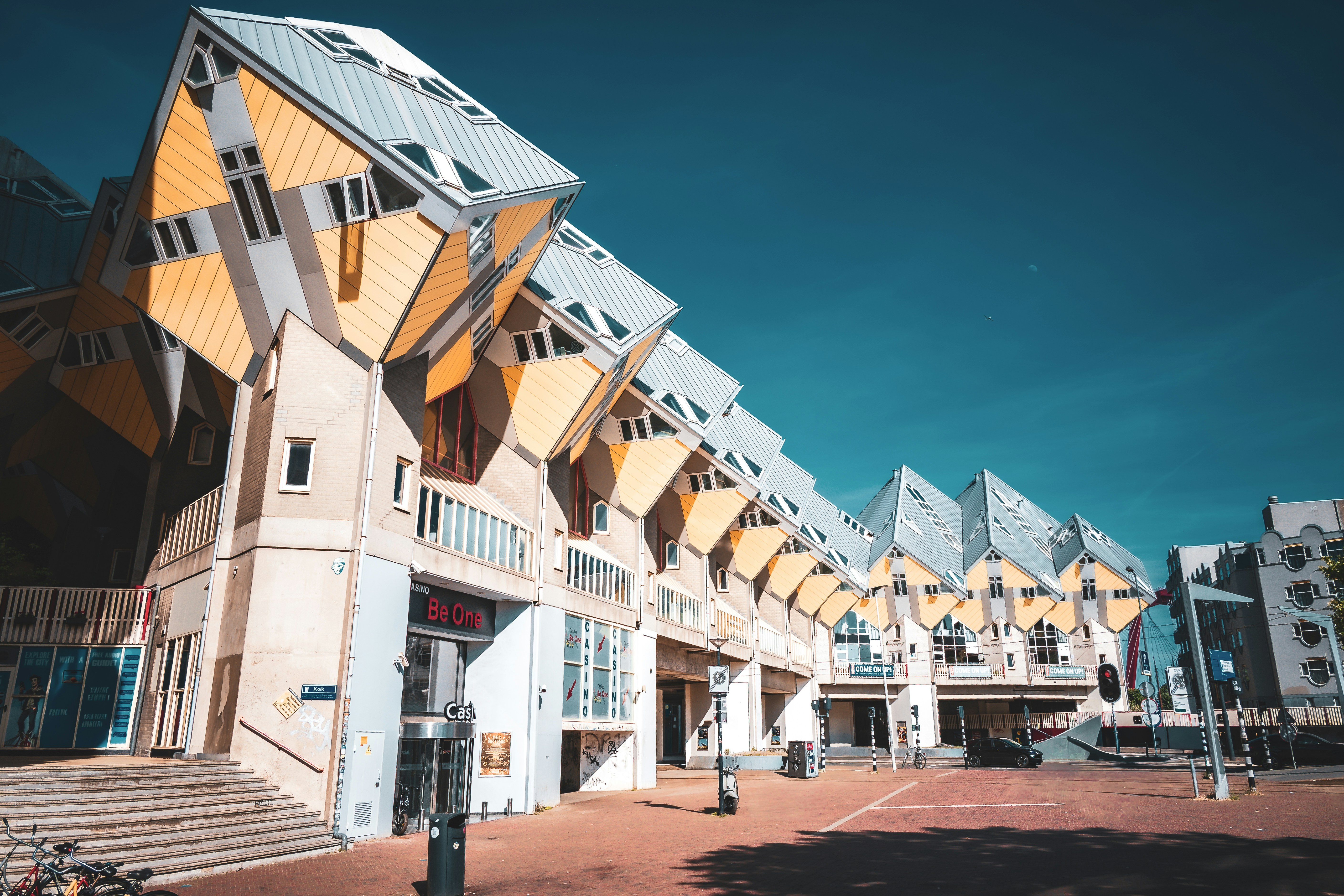 Angular Market Row: Colorful Housing Facades Meet Modern Retail