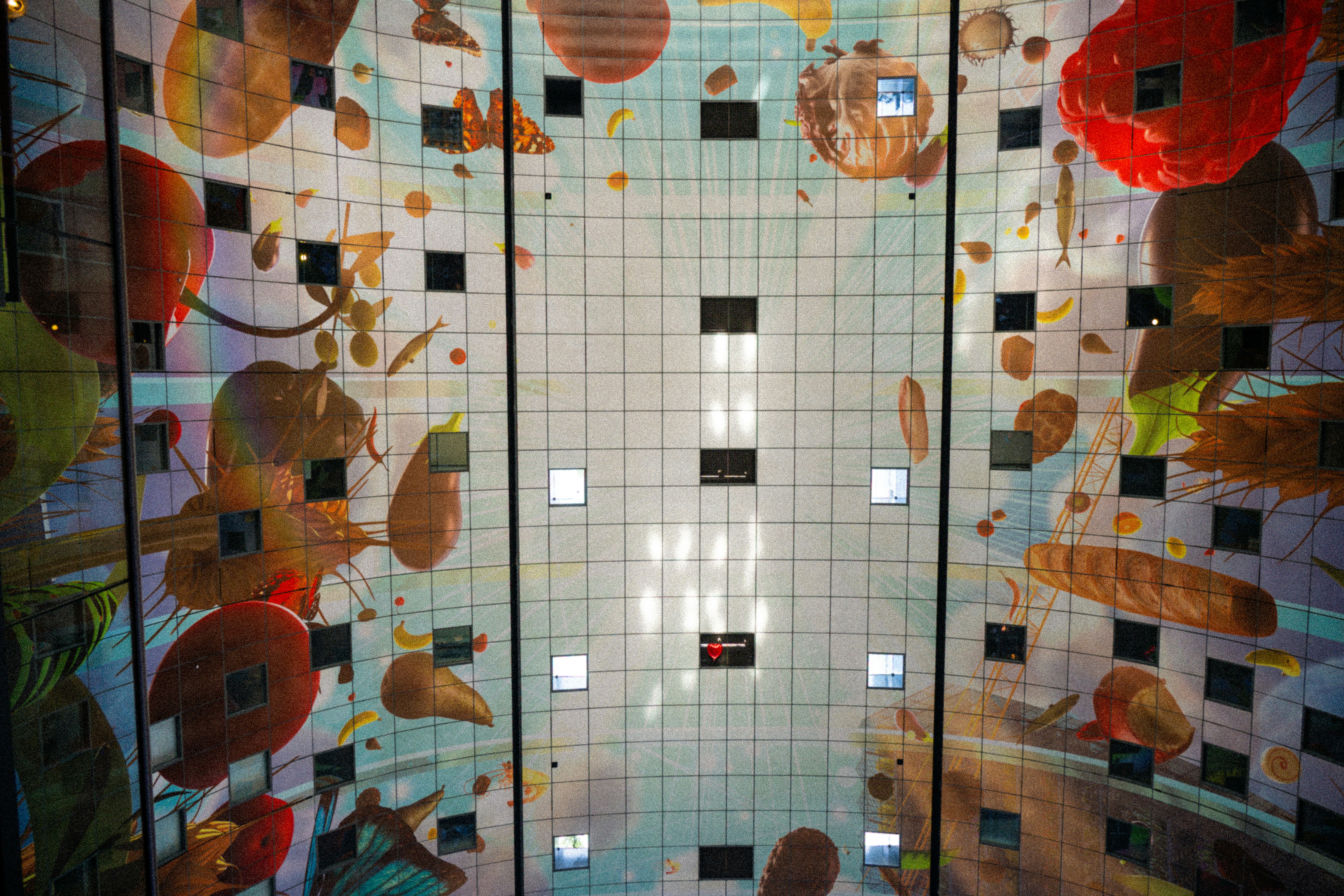 Reflections Above: An Abstract Glass Ceiling of Floating Orbs and Gridded Light