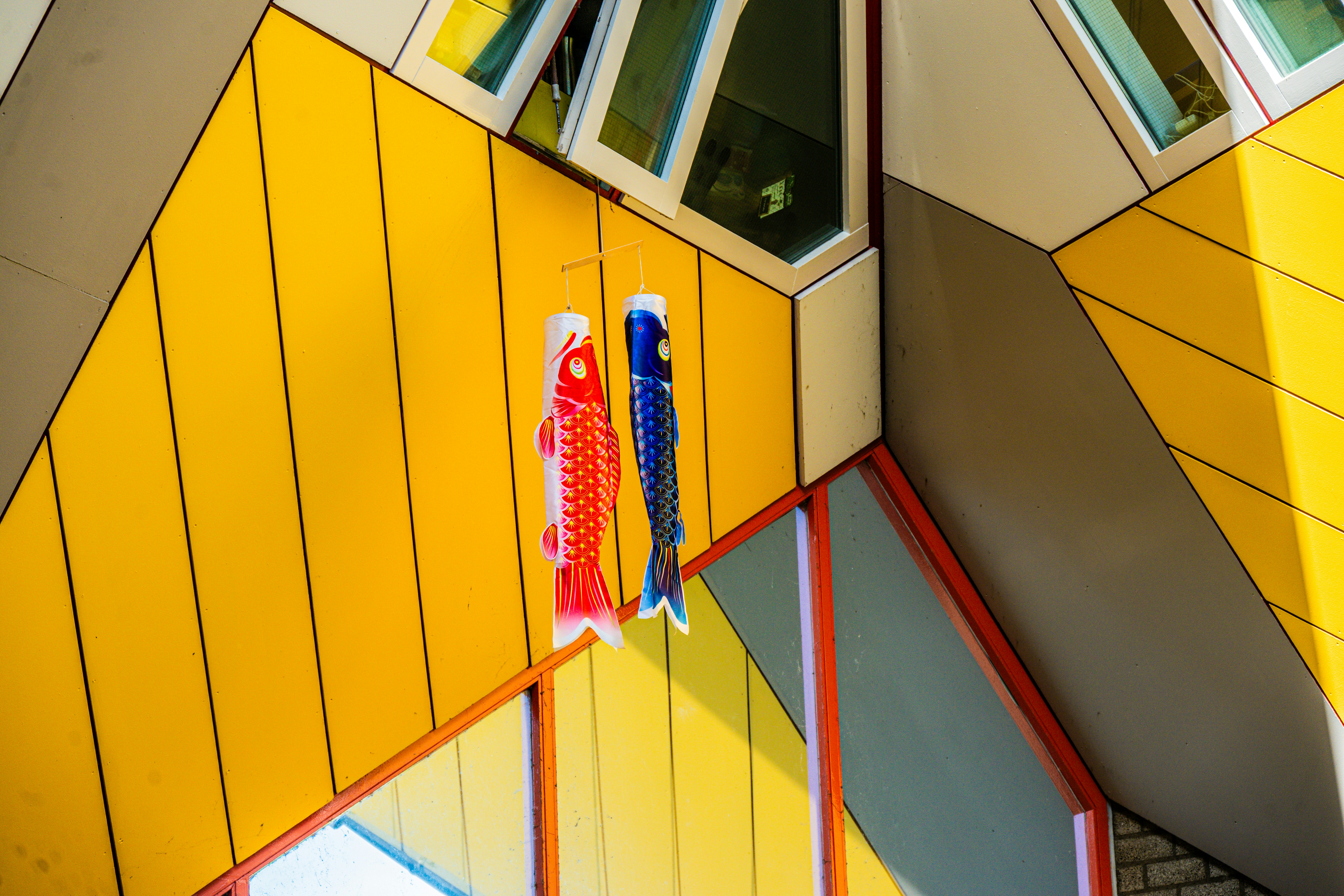 Colorful Facade Quartet: Koinobori Adrift on Geometric Walls