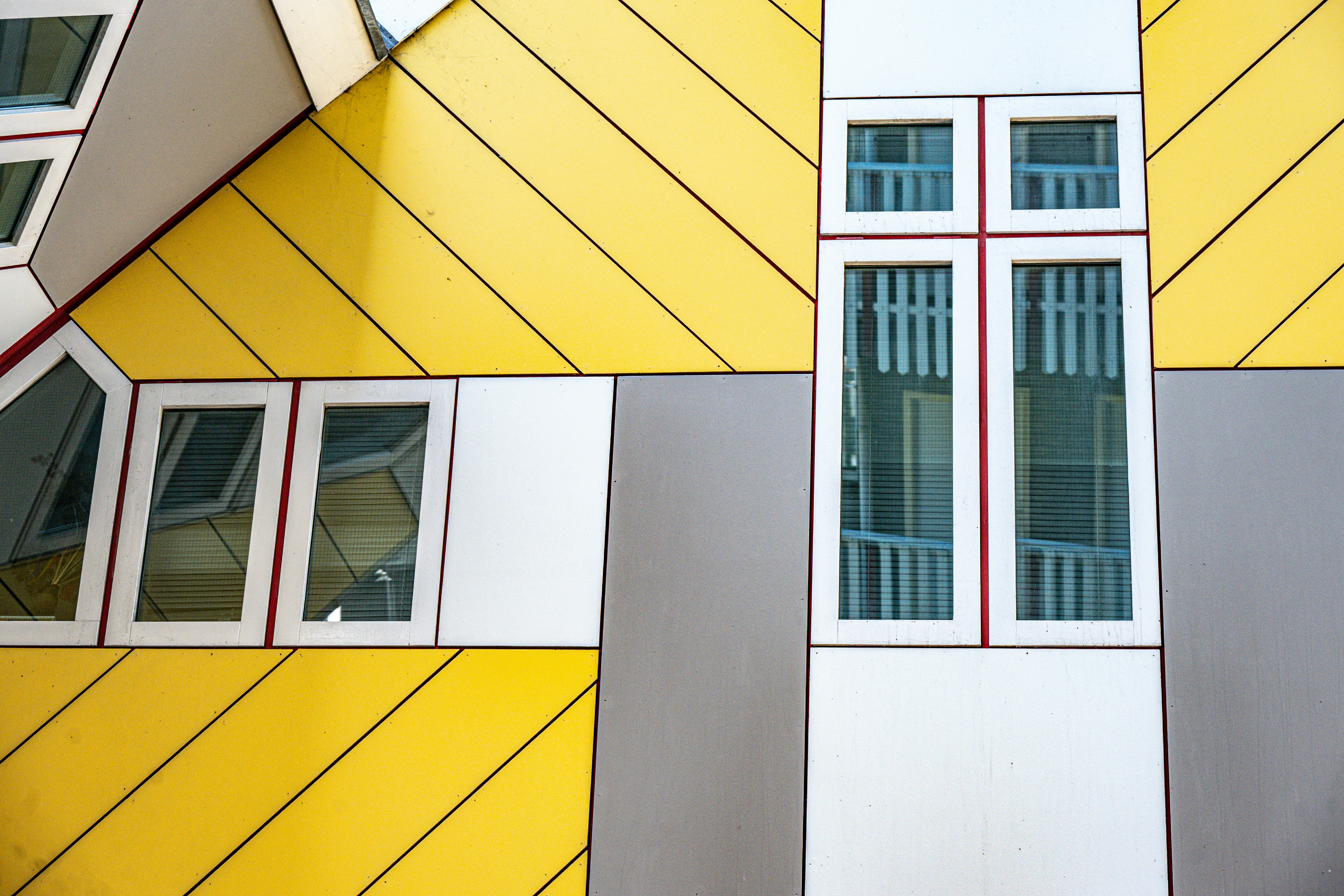 Yellow Facade Portrait: Geometric Dance of Panels and Windows
