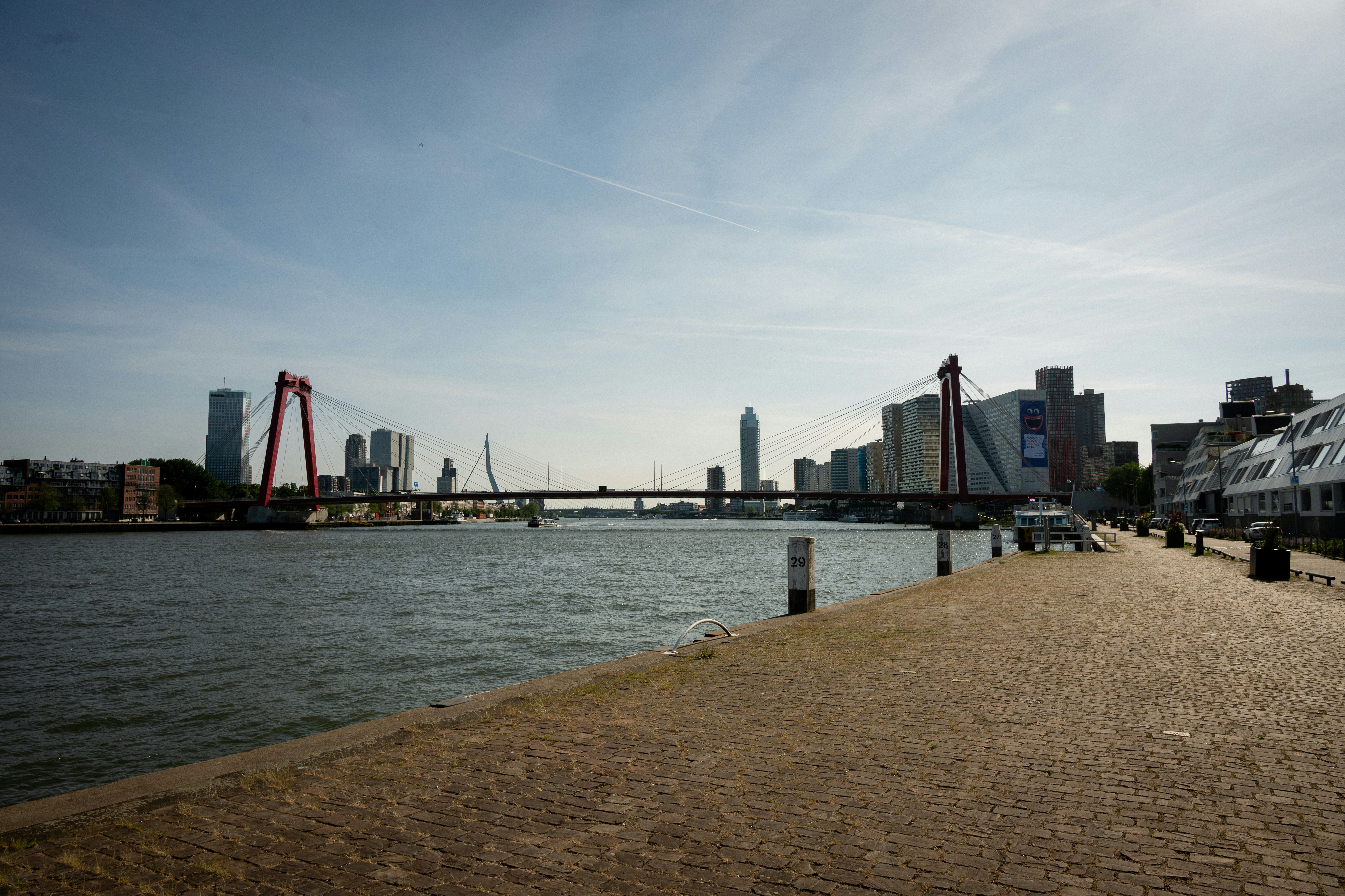 Riverside Crossing: City Skyline Framed by a Puissant Bridge