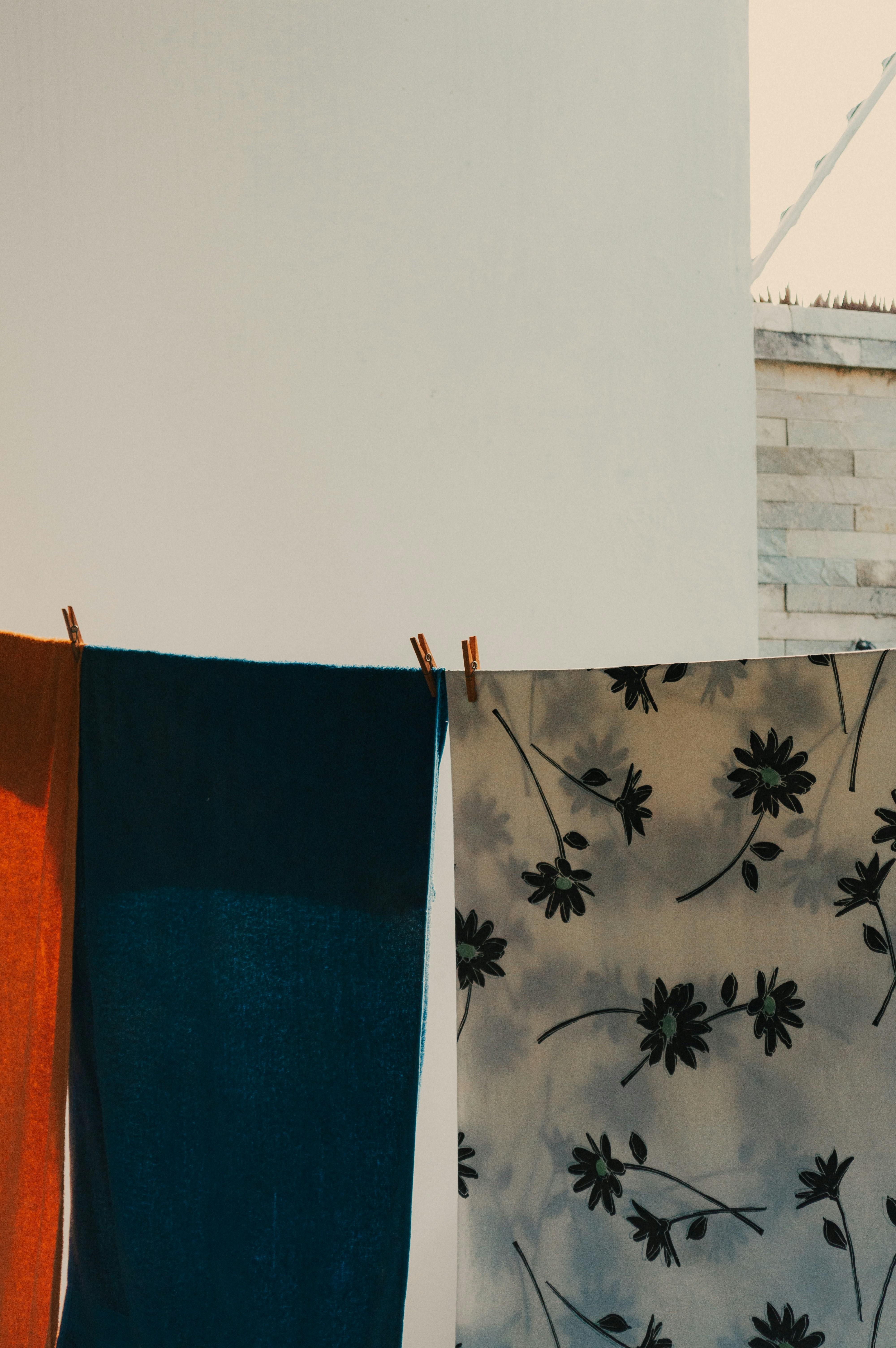 Clothesline Portrait: Fabric, Light, and Line in a Quiet Courtyard