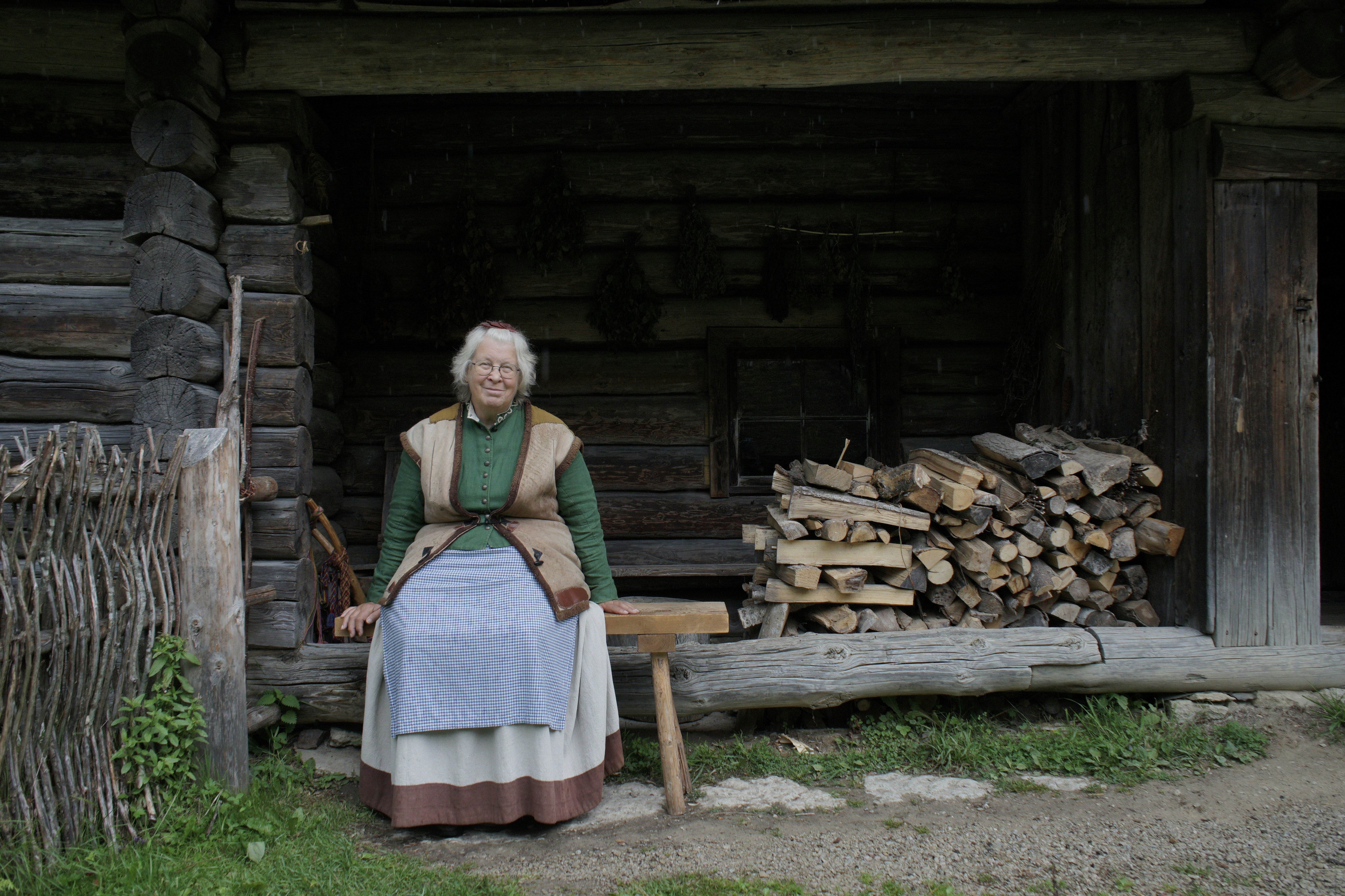 Old Benchkeeper by the Woodpile