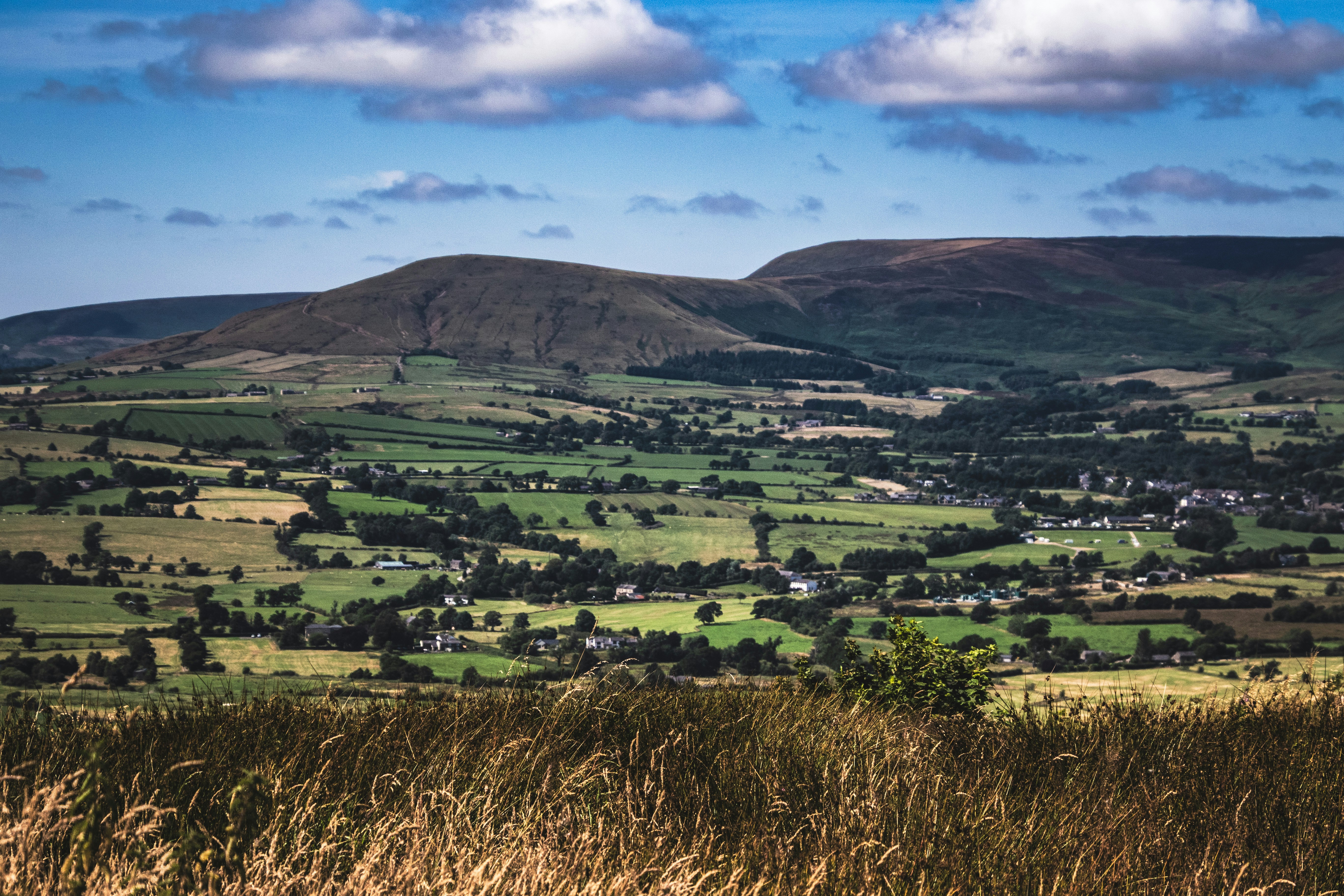 Rolling Moor and Patchwork Valley under Blue Skies