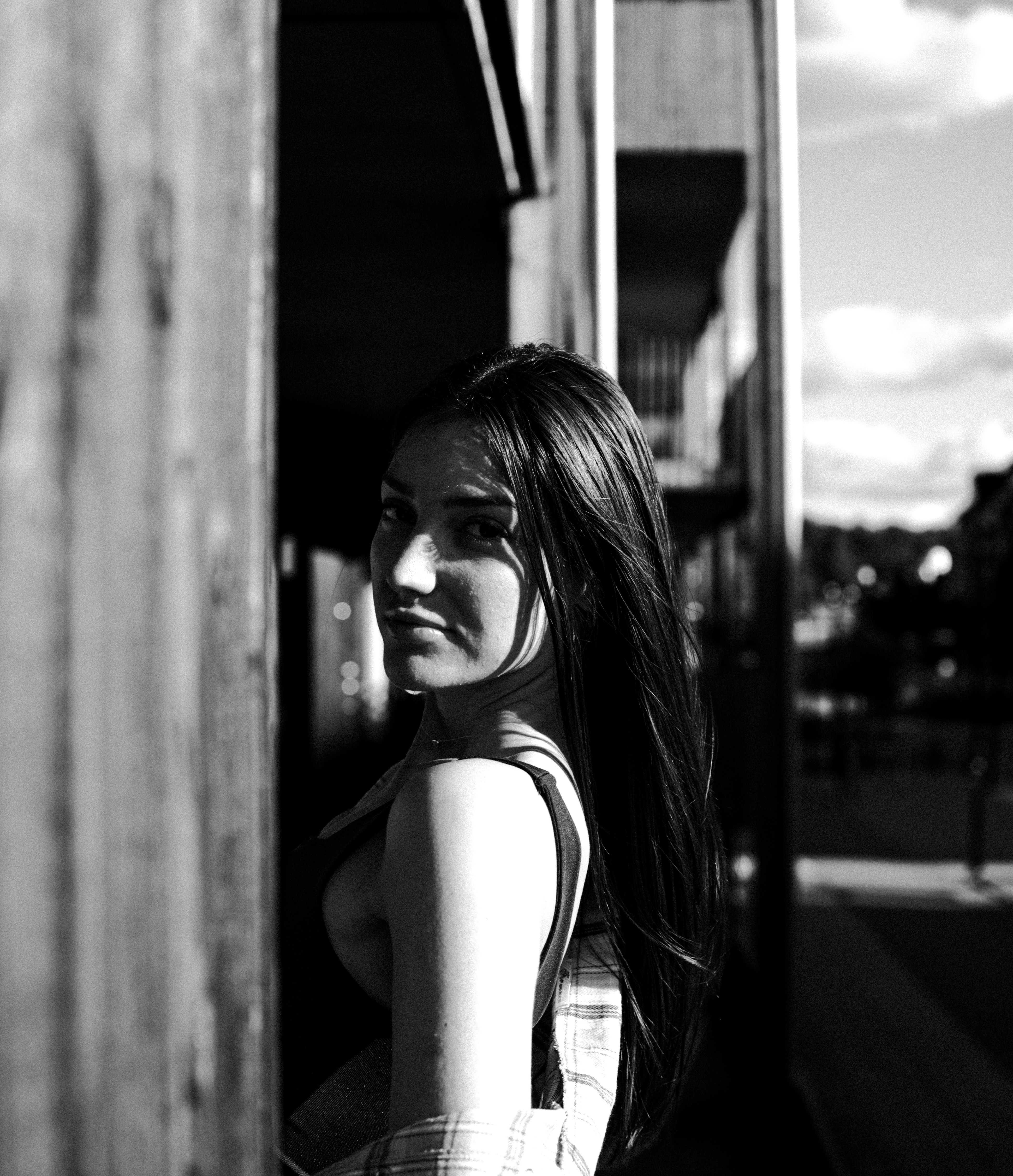 Bridge of Light: Portrait in Shadowed Columns