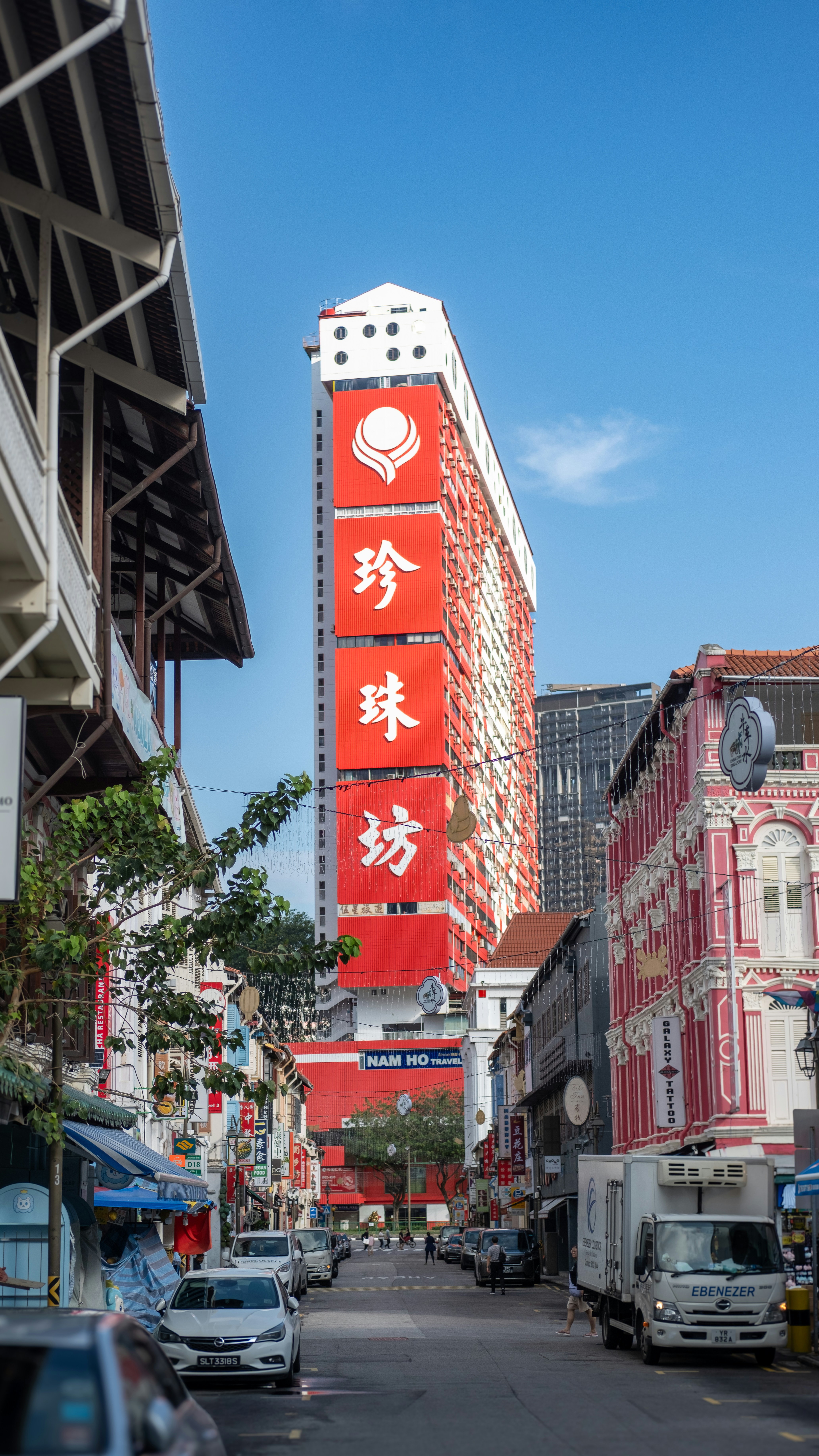 Neon Tower of Chinatown: The Red Signage Ascent